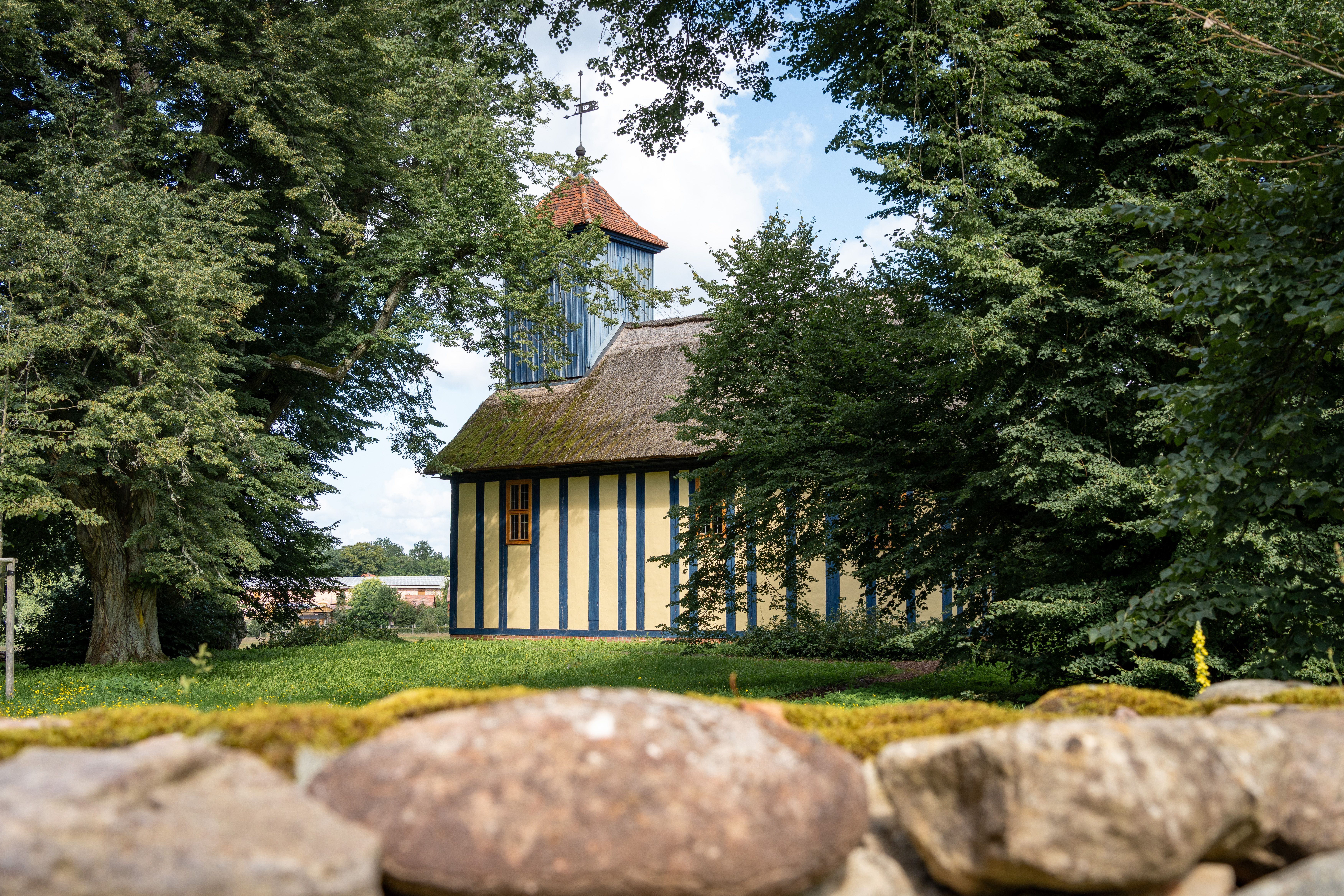 Charming Village Chapel in a Lush Green Landscape · Free Stock Photo