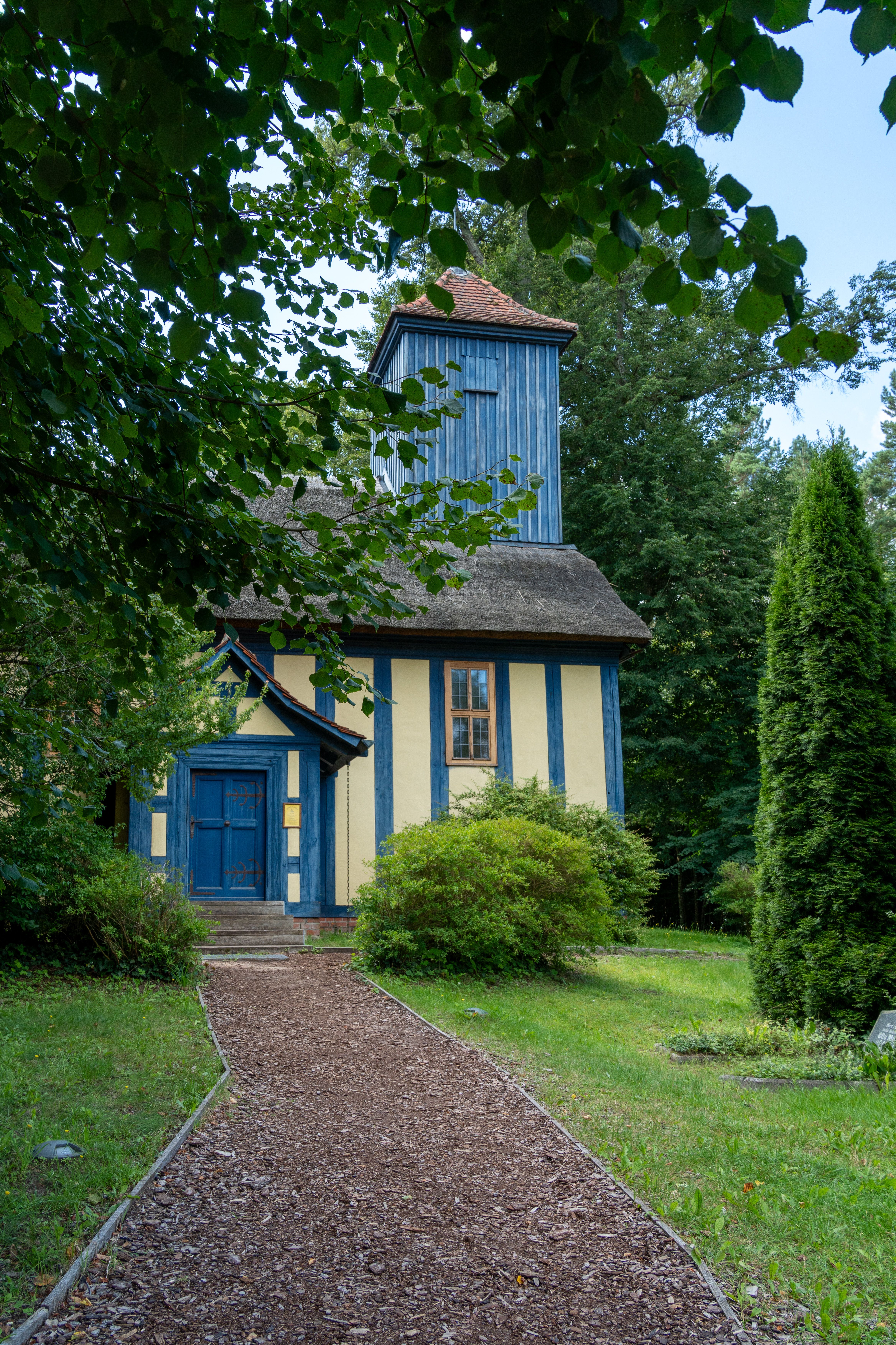 Charming Traditional Village Church in Forest Setting · Free Stock Photo