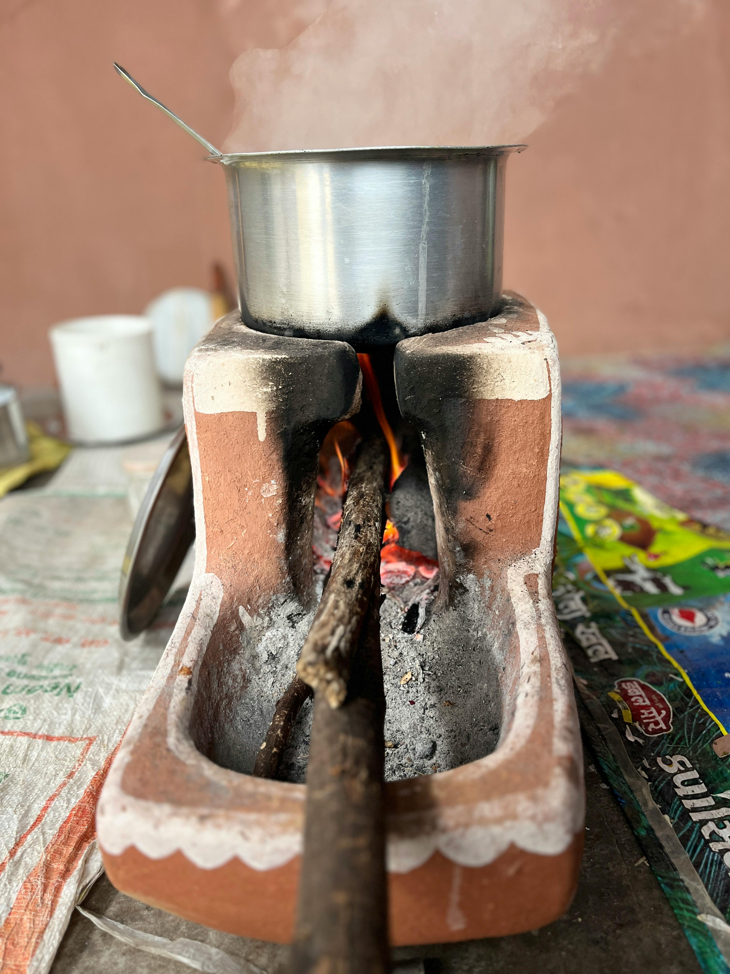 Traditional Clay Stove with Boiling Pot · Free Stock Photo