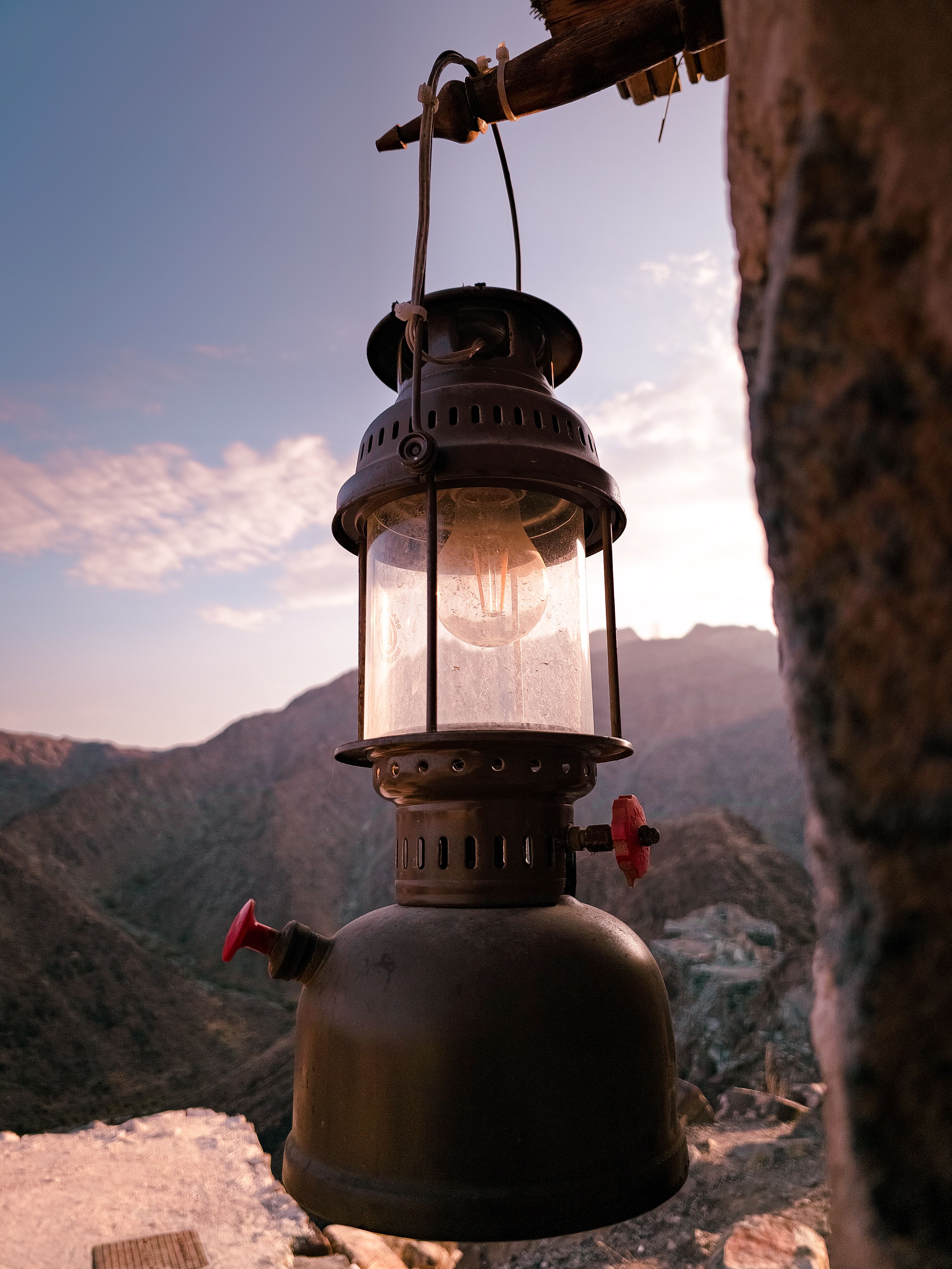 Vintage Lantern in Mountainous Landscape · Free Stock Photo