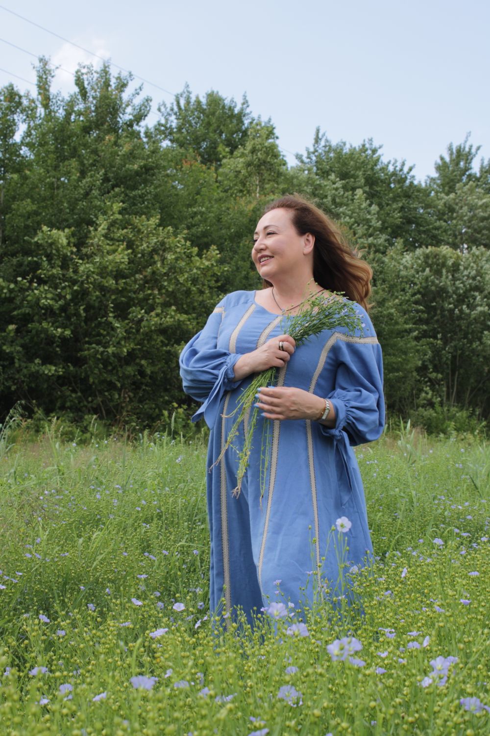 Woman in Blue Dress Enjoying Nature Outdoors · Free Stock Photo