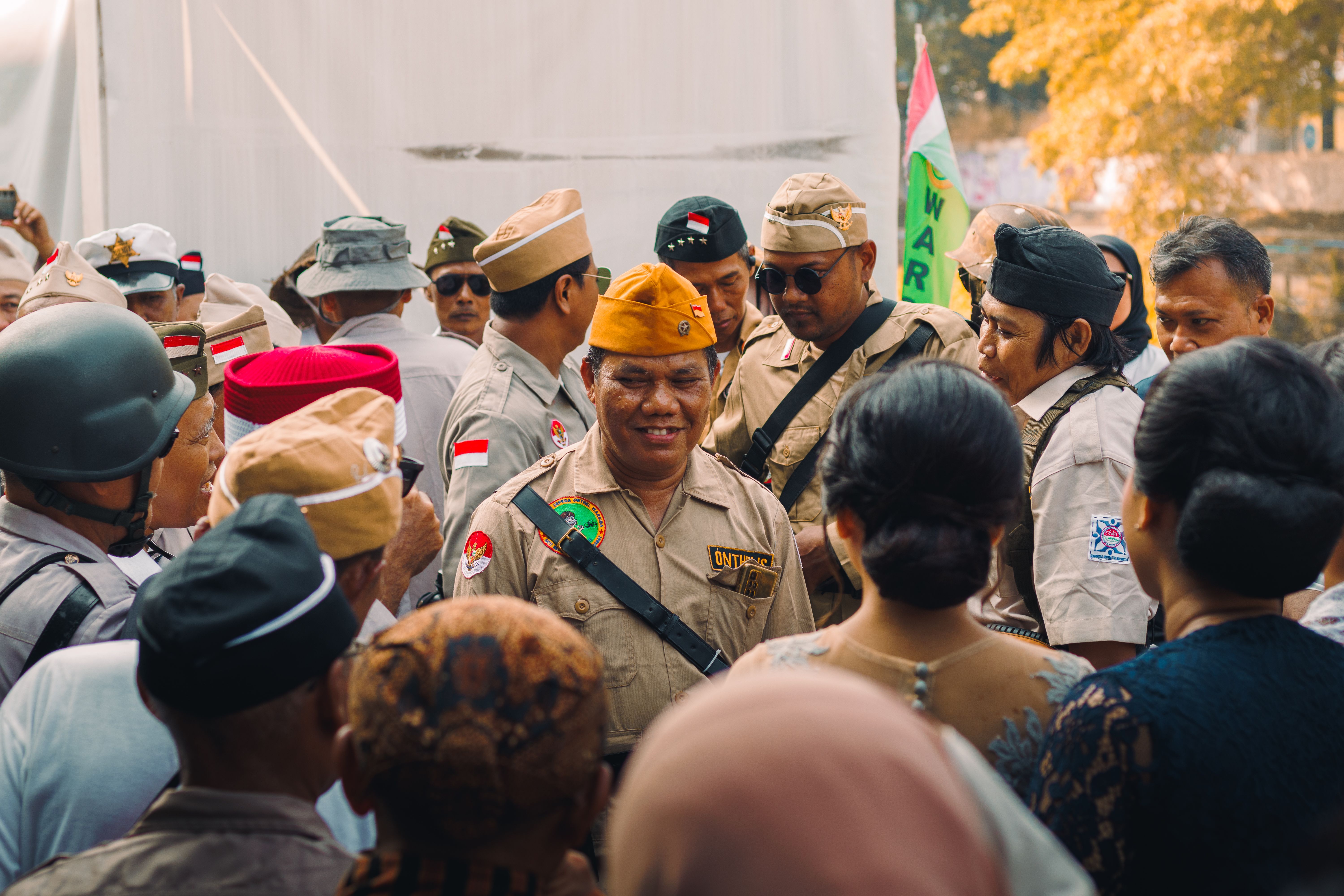 Group of People in Vintage Military Uniforms Gathering · Free Stock Photo