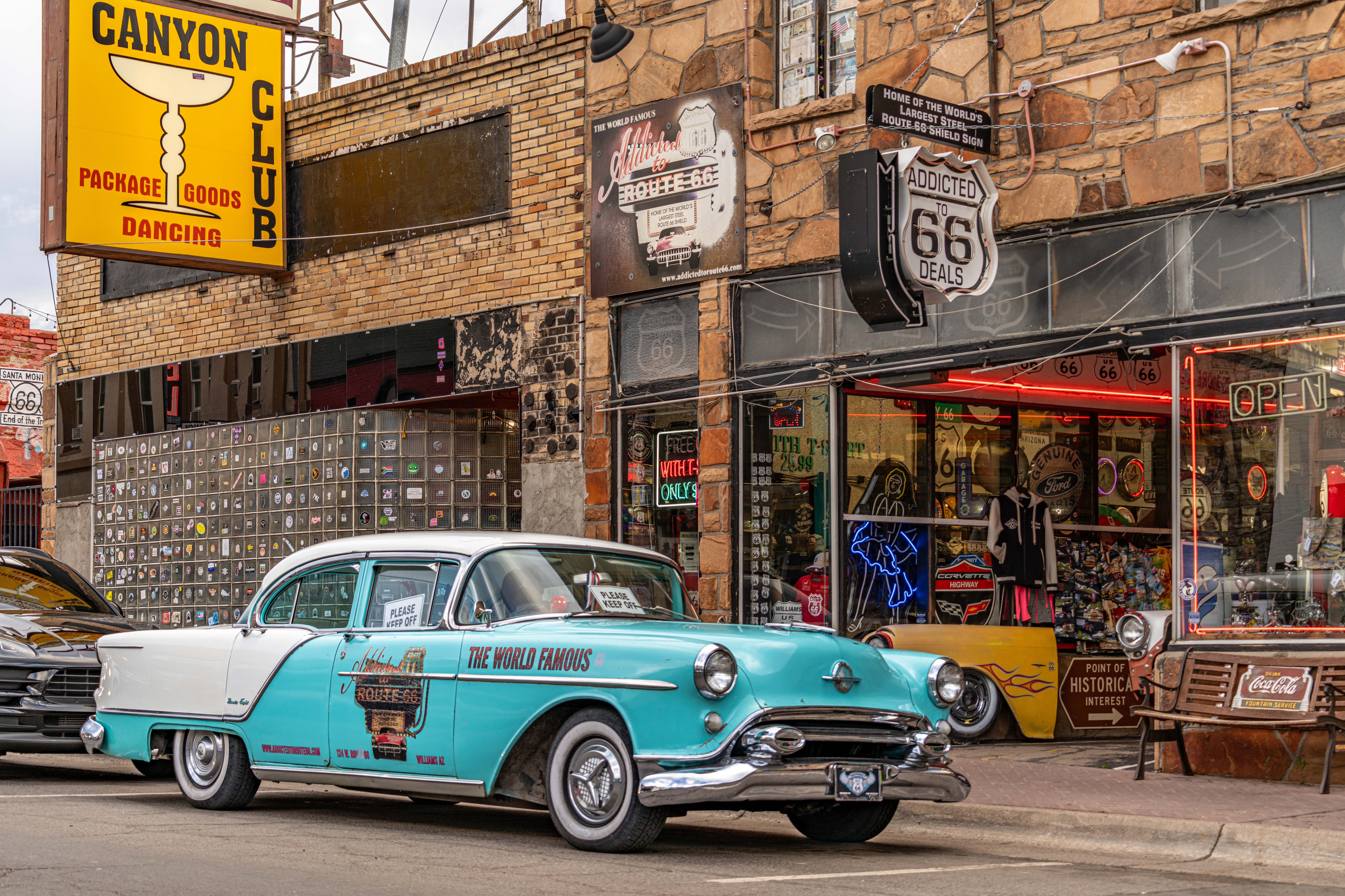Vintage Car and Storefront on Route 66 · Free Stock Photo