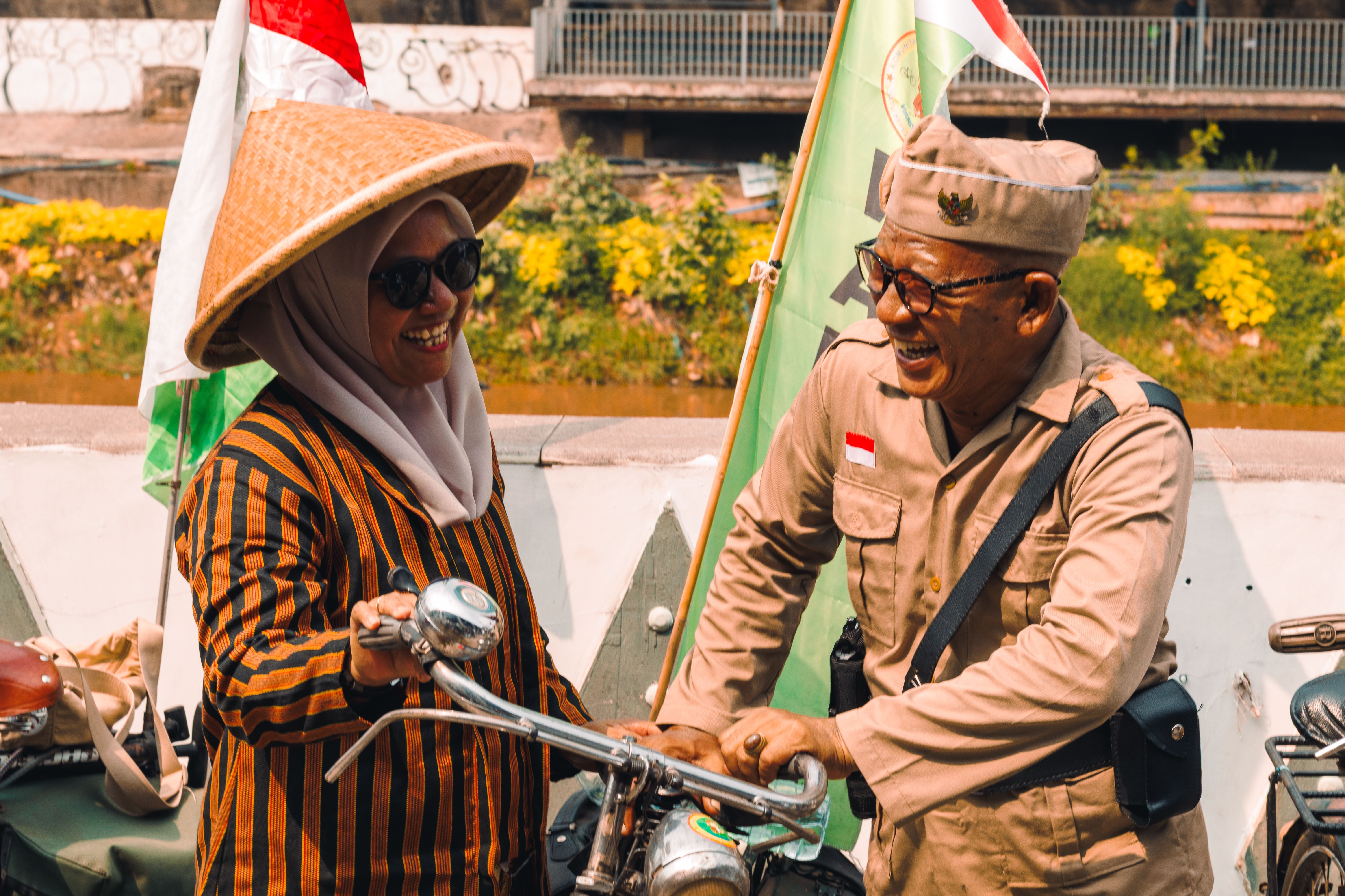 Traditional Indonesian Attire with Vintage Bikes · Free Stock Photo