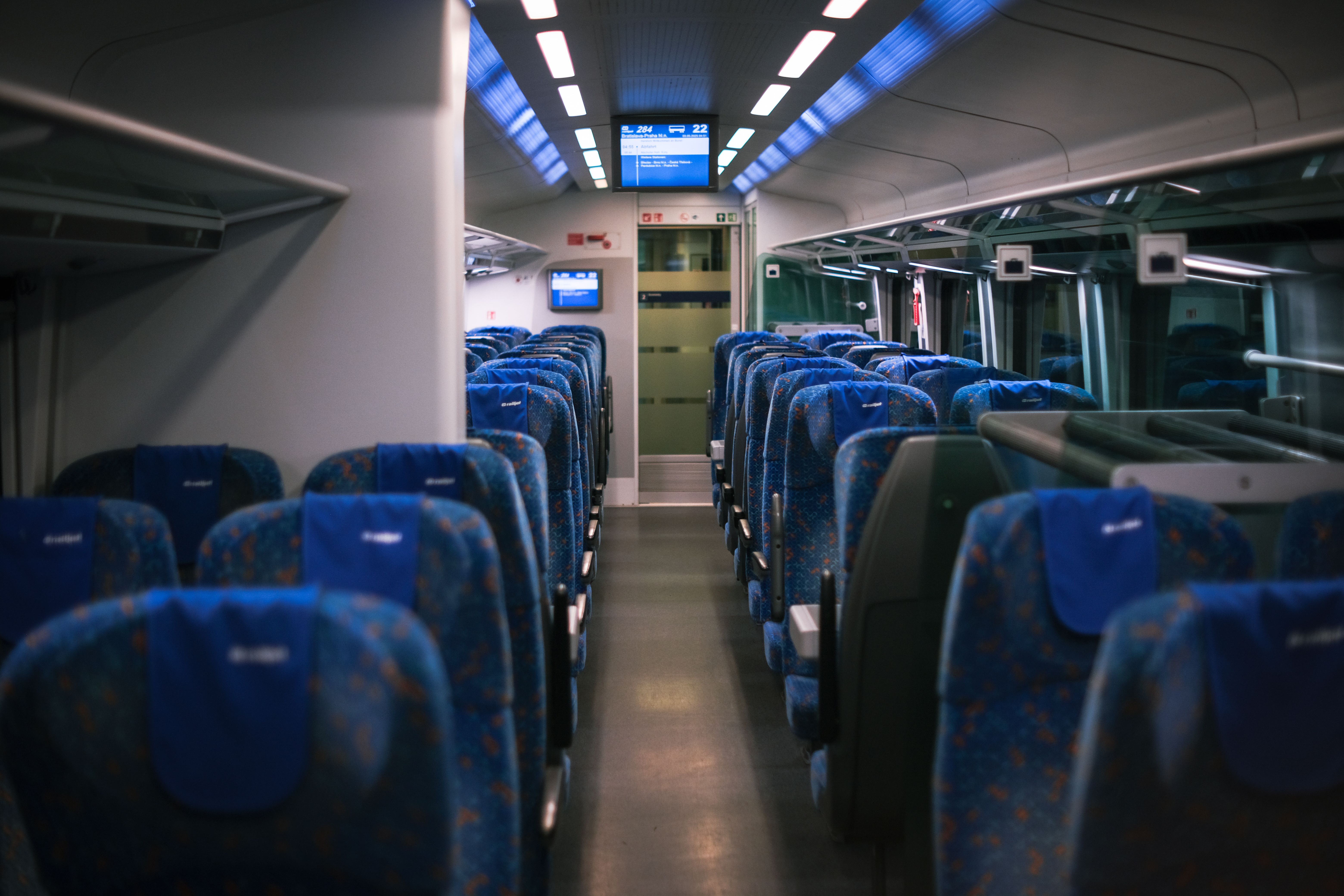 Empty Blue-Seated Train Interior on Still Evening · Free Stock Photo