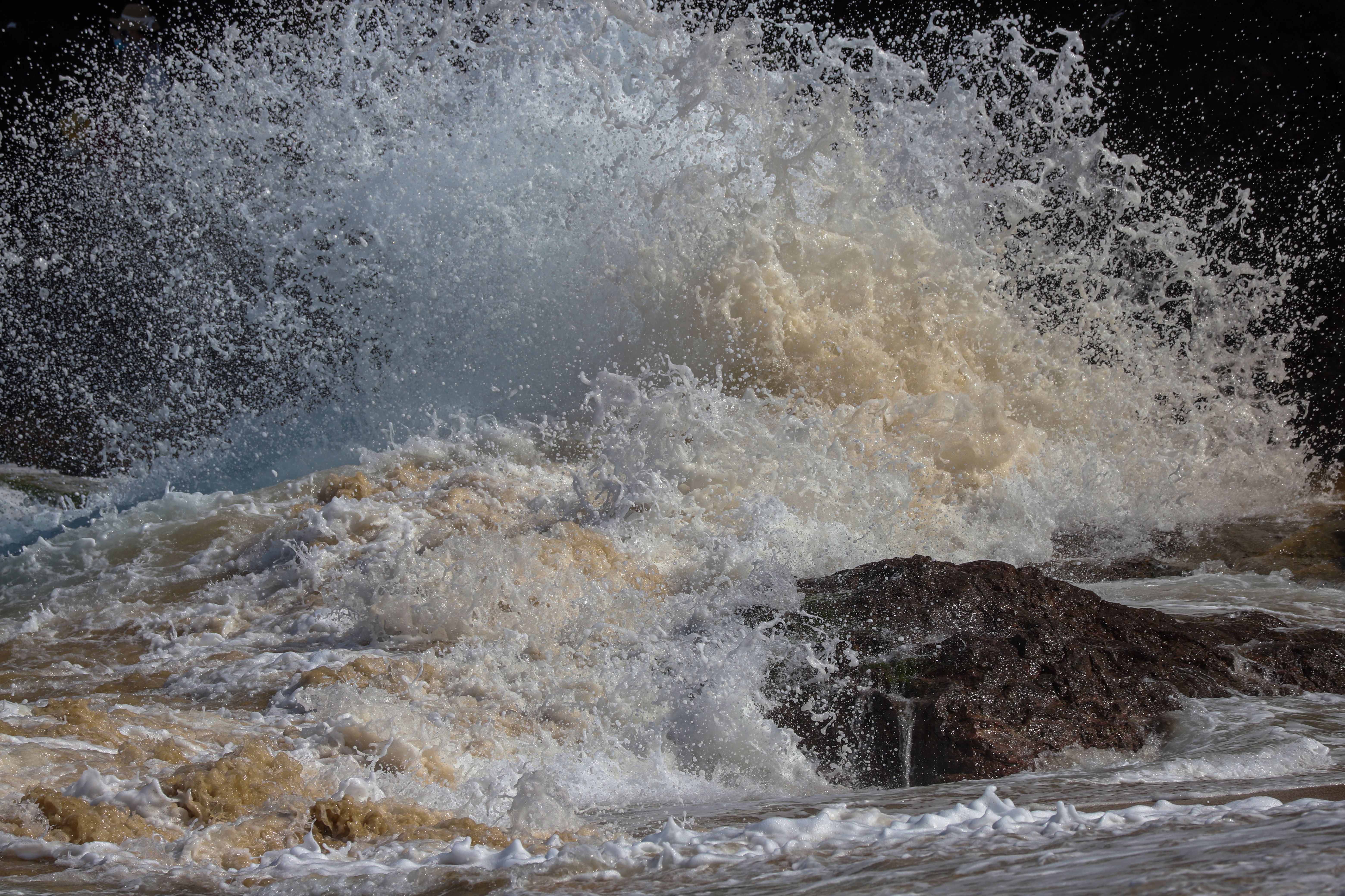 Dramatic Ocean Wave Crashing on Rocks · Free Stock Photo