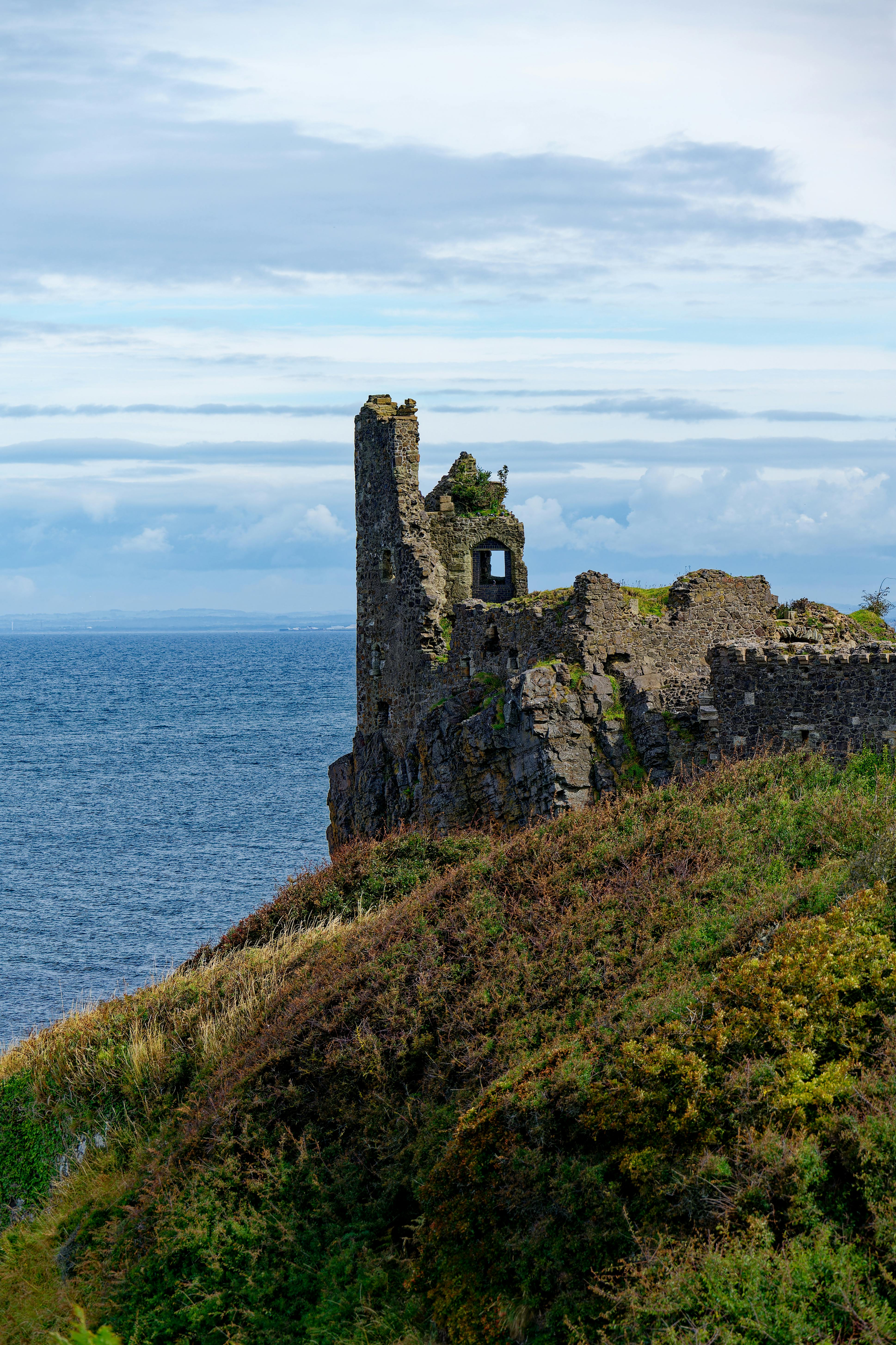 Low-angle Photography of Gray Stone House on Boulder · Free Stock Photo