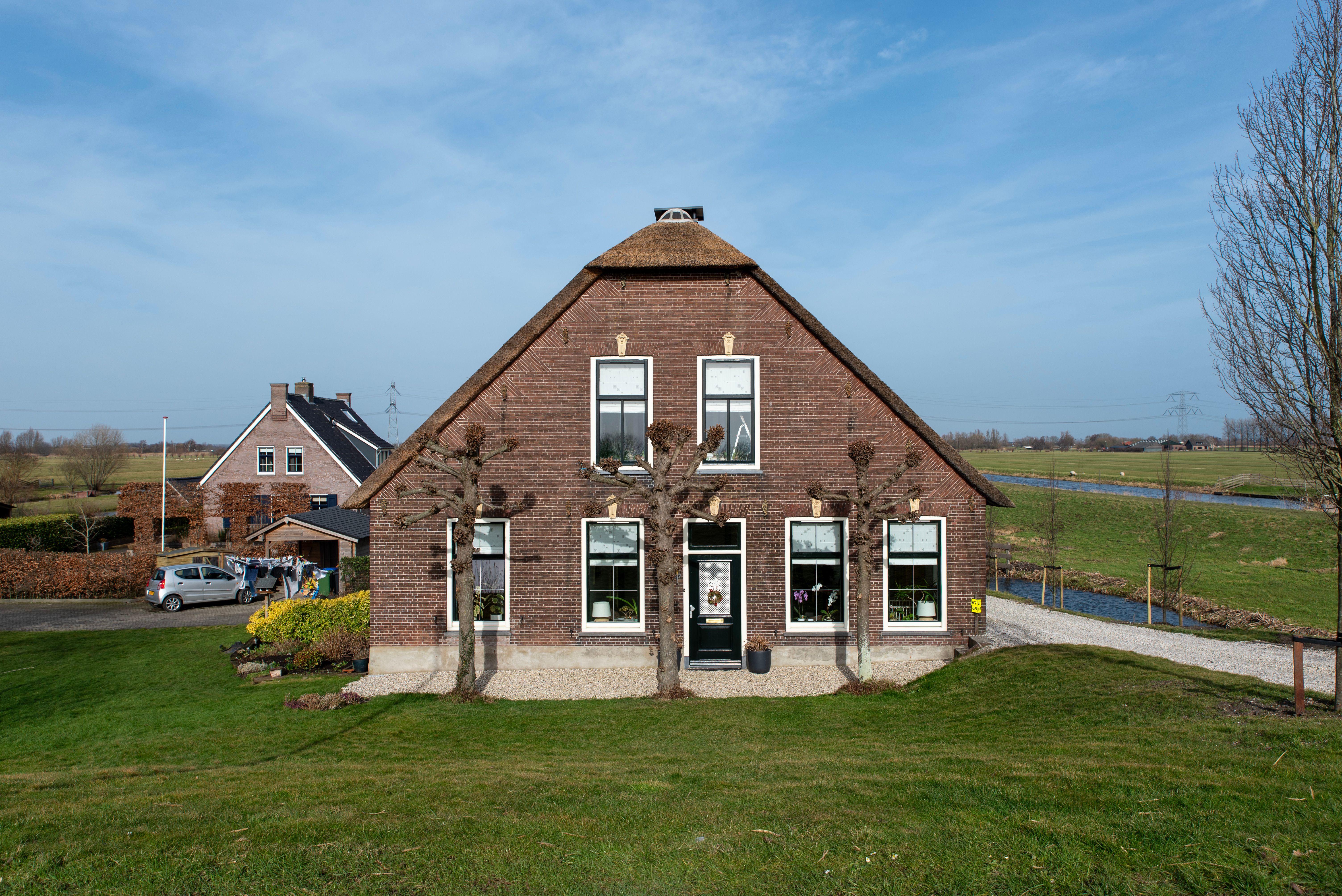 Traditional Dutch Farmhouse in Rural Landscape · Free Stock Photo