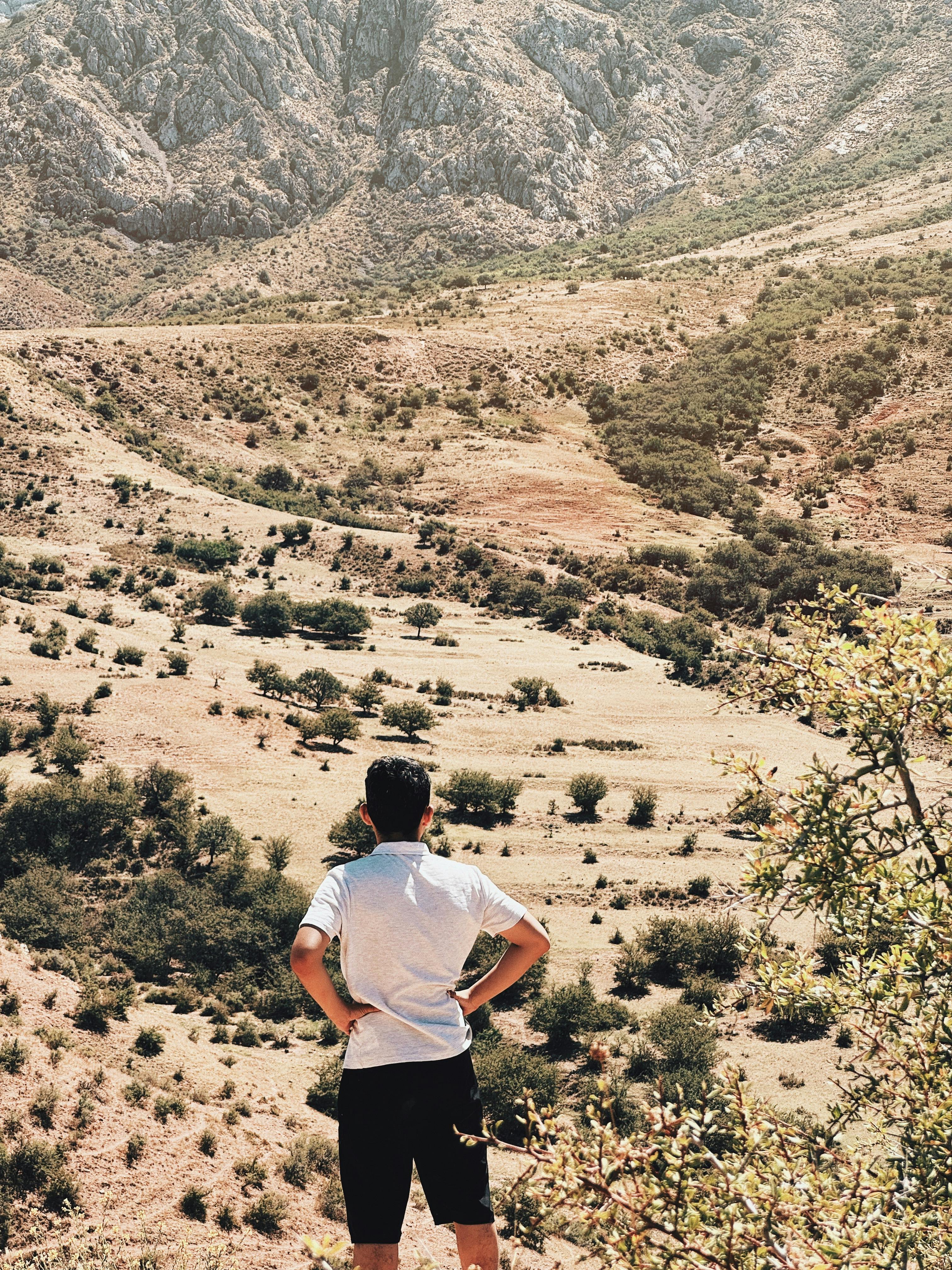 Man Admiring Arid Mountain Landscape View · Free Stock Photo