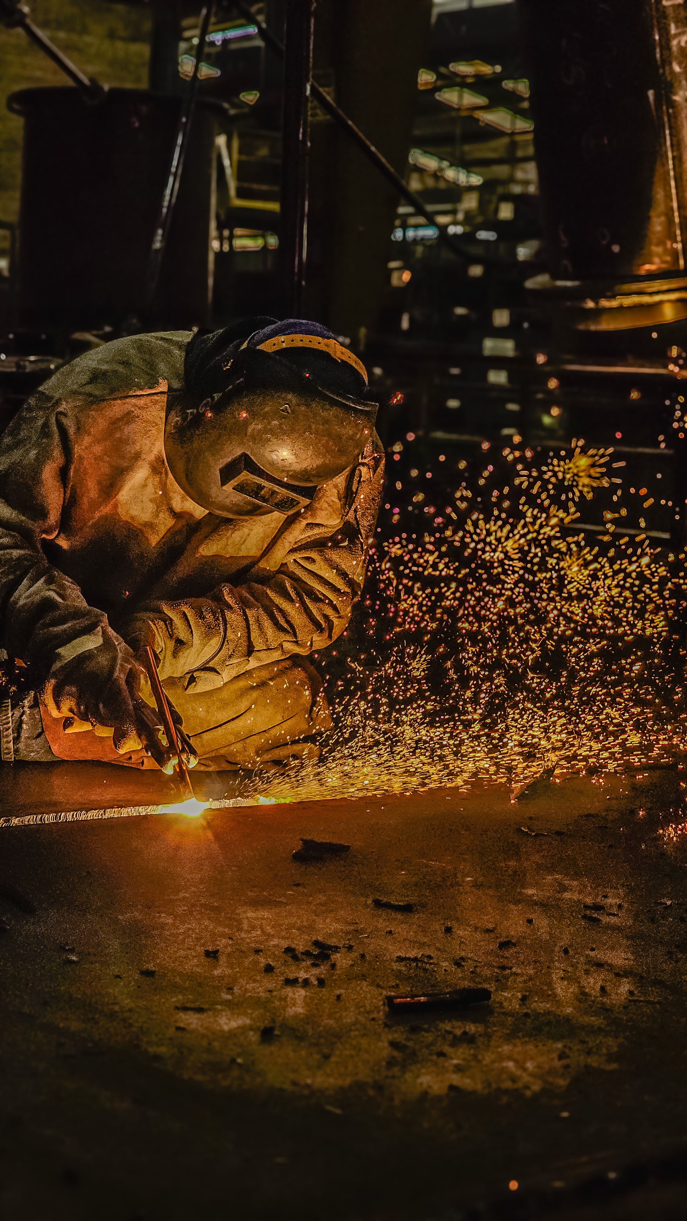 Industrial Welder at Work Amidst Sparks · Free Stock Photo