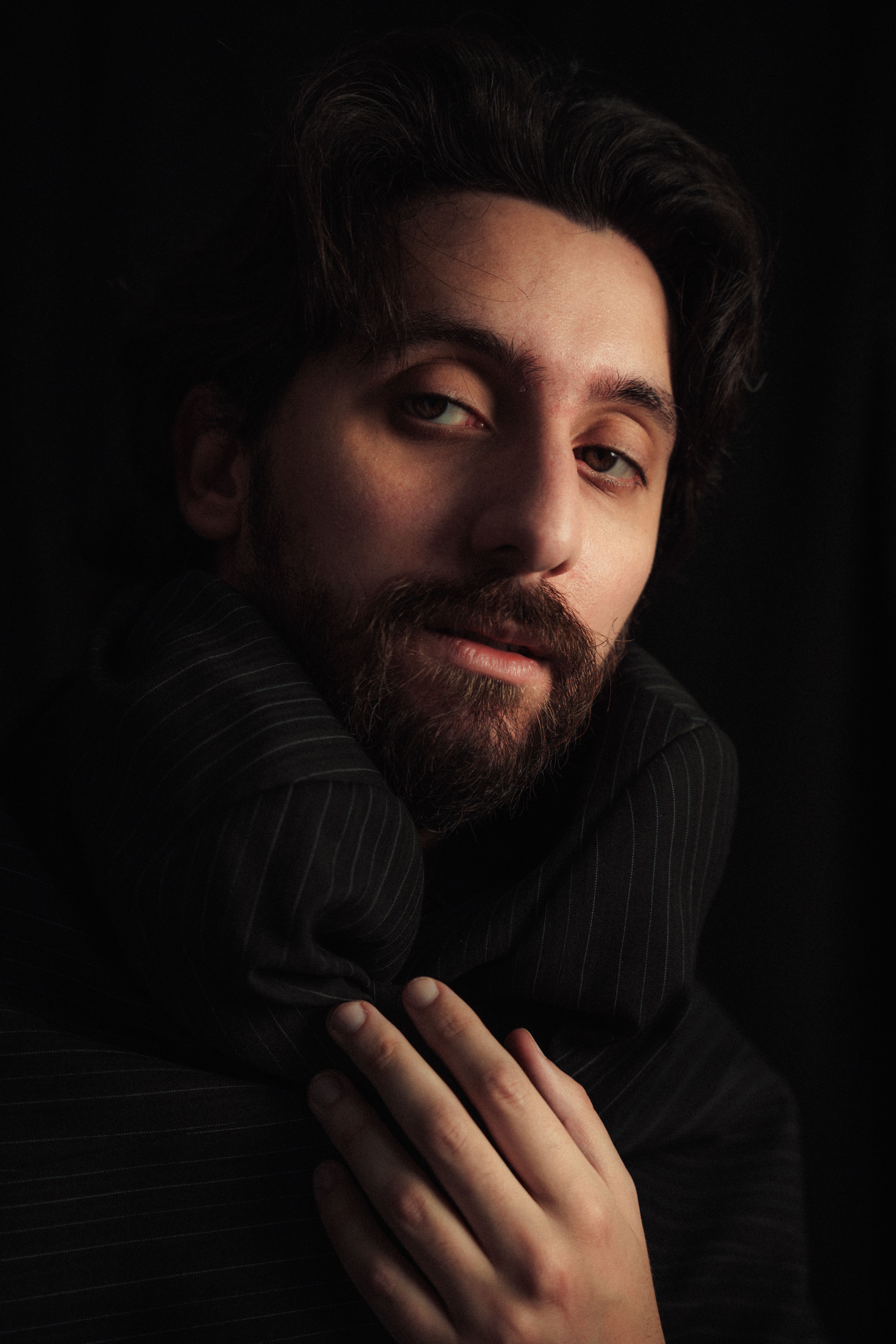 Moody Portrait of a Bearded Man in Dramatic Light · Free Stock Photo