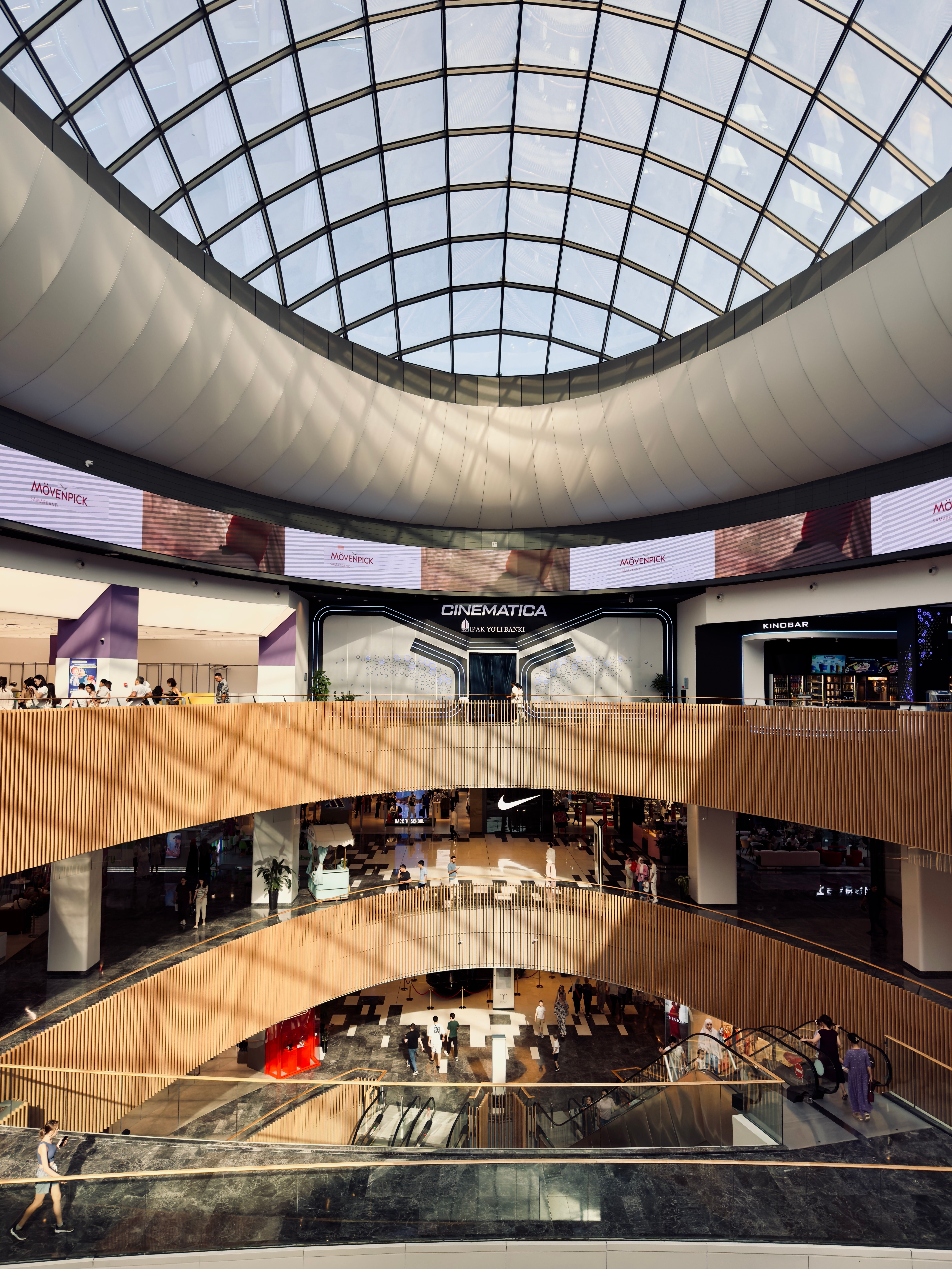 Modern Shopping Mall Interior with Glass Roof · Free Stock Photo