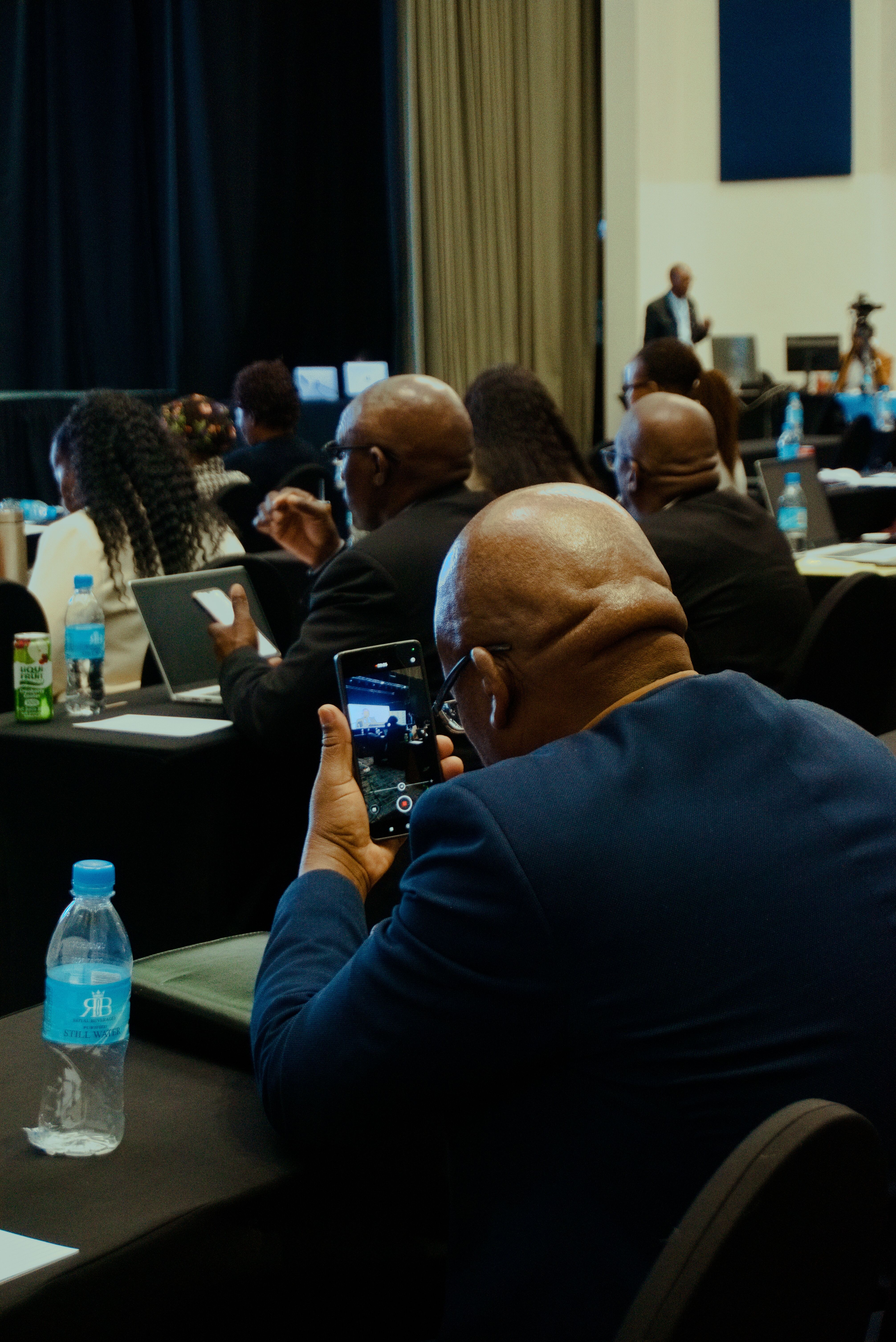 A Woman Speaking at a Conference · Free Stock Photo