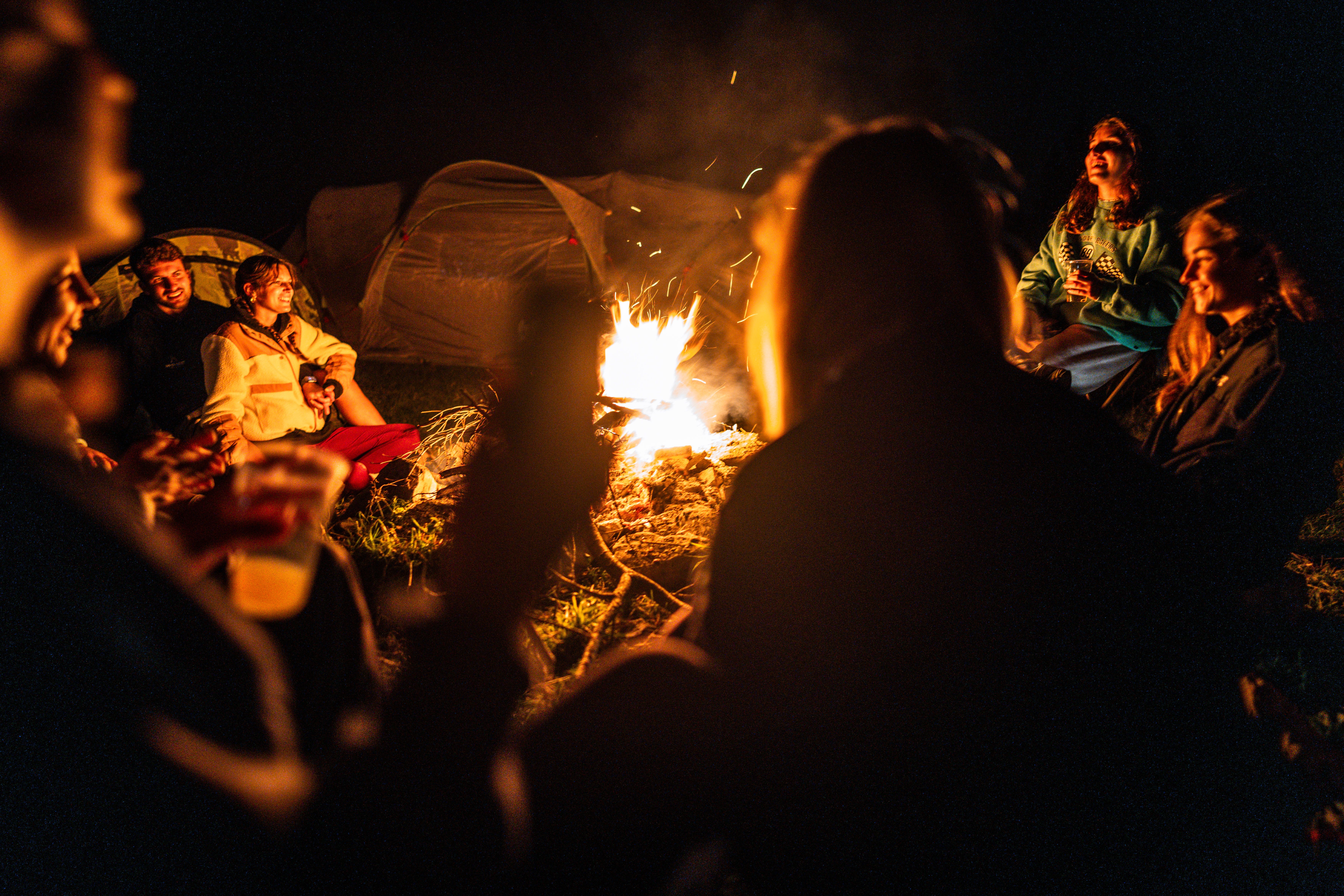 Campfire Gathering Under Night Sky in Schilpario · Free Stock Photo