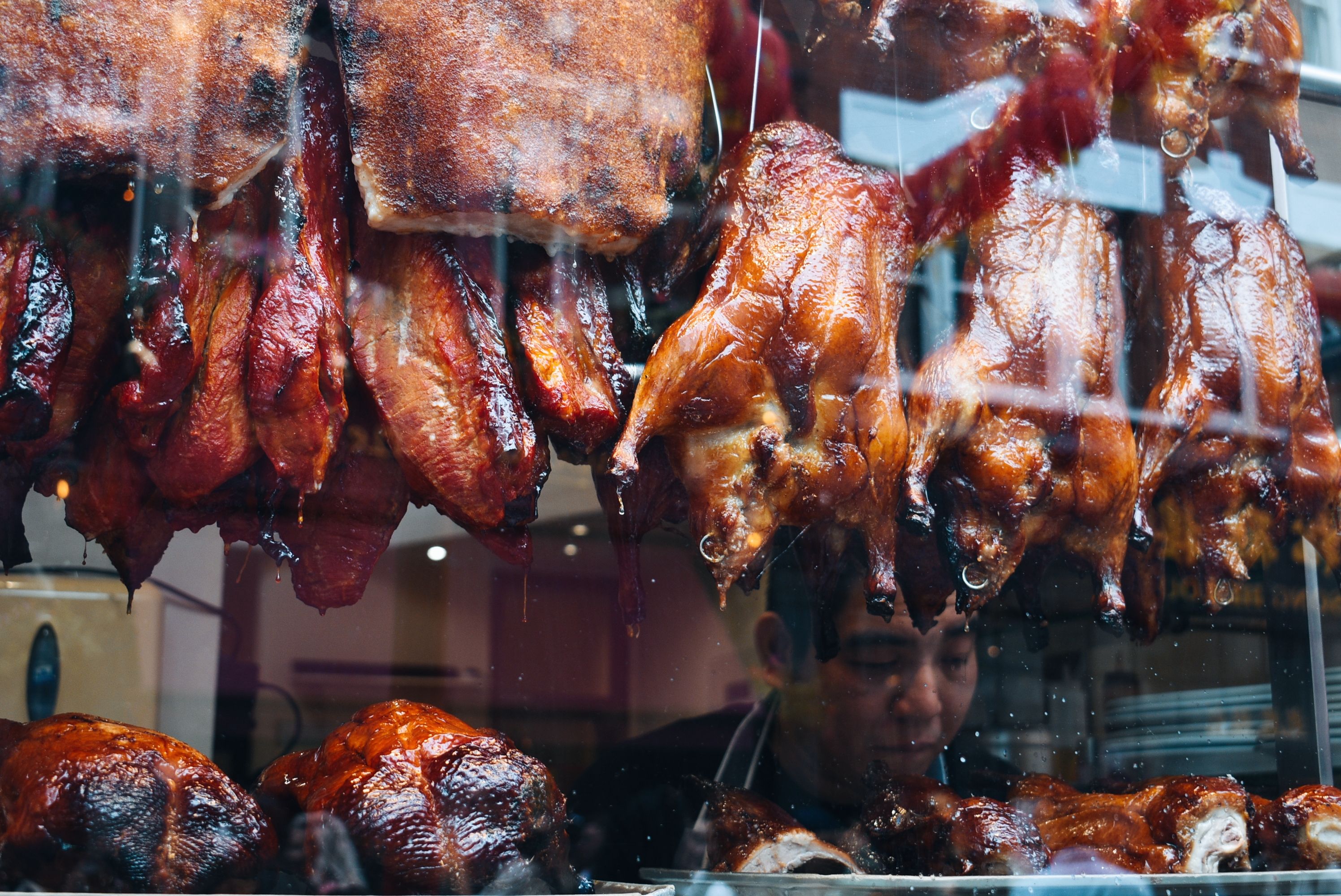 Roasted Duck and Pork Display in Chinese Deli · Free Stock Photo