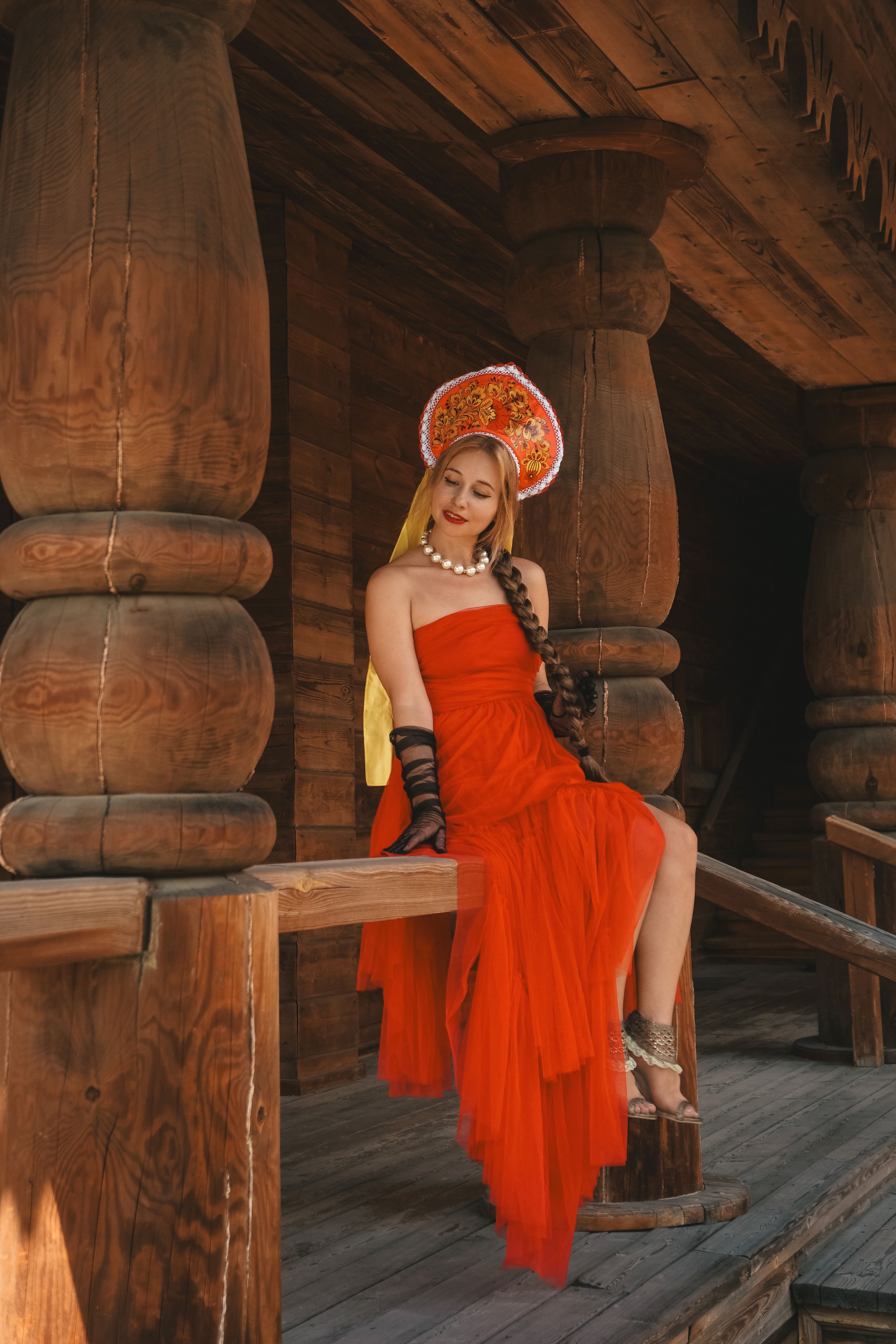 Elegant Woman in Traditional Attire at Rustic Venue · Free Stock Photo