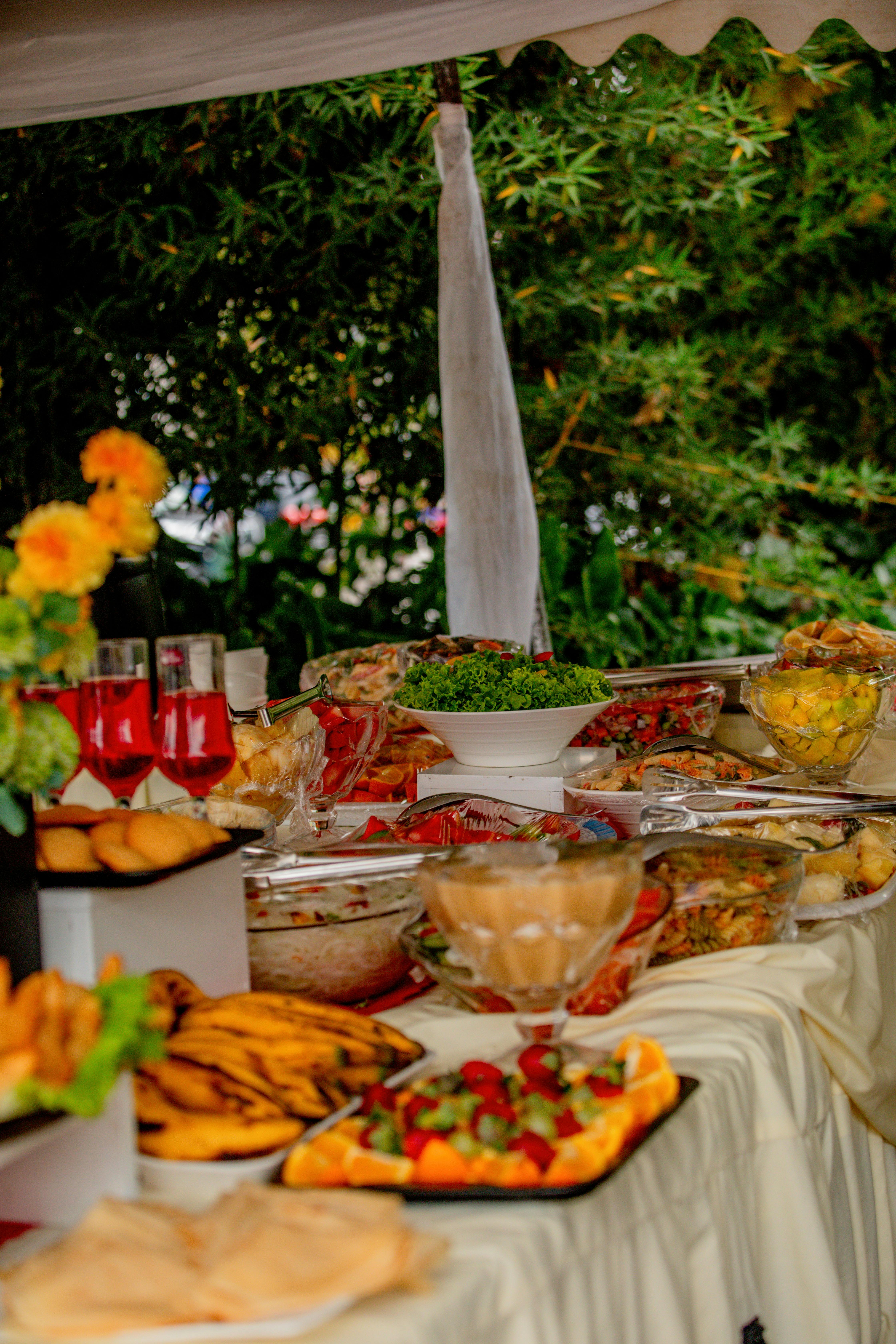 Colorful Buffet Table with Assorted Dishes · Free Stock Photo