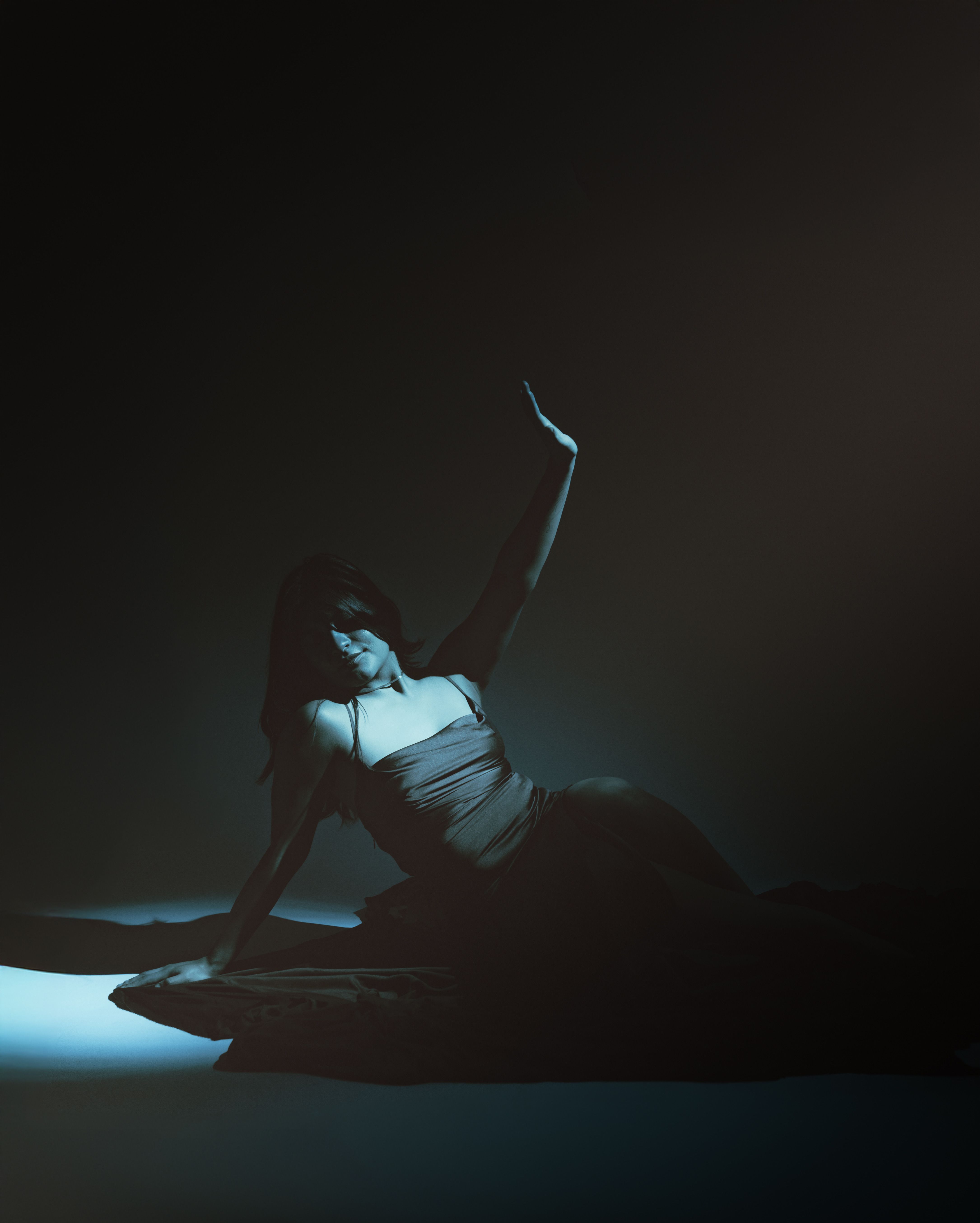 Artistic Pose in Dramatic Low Light Setting · Free Stock Photo