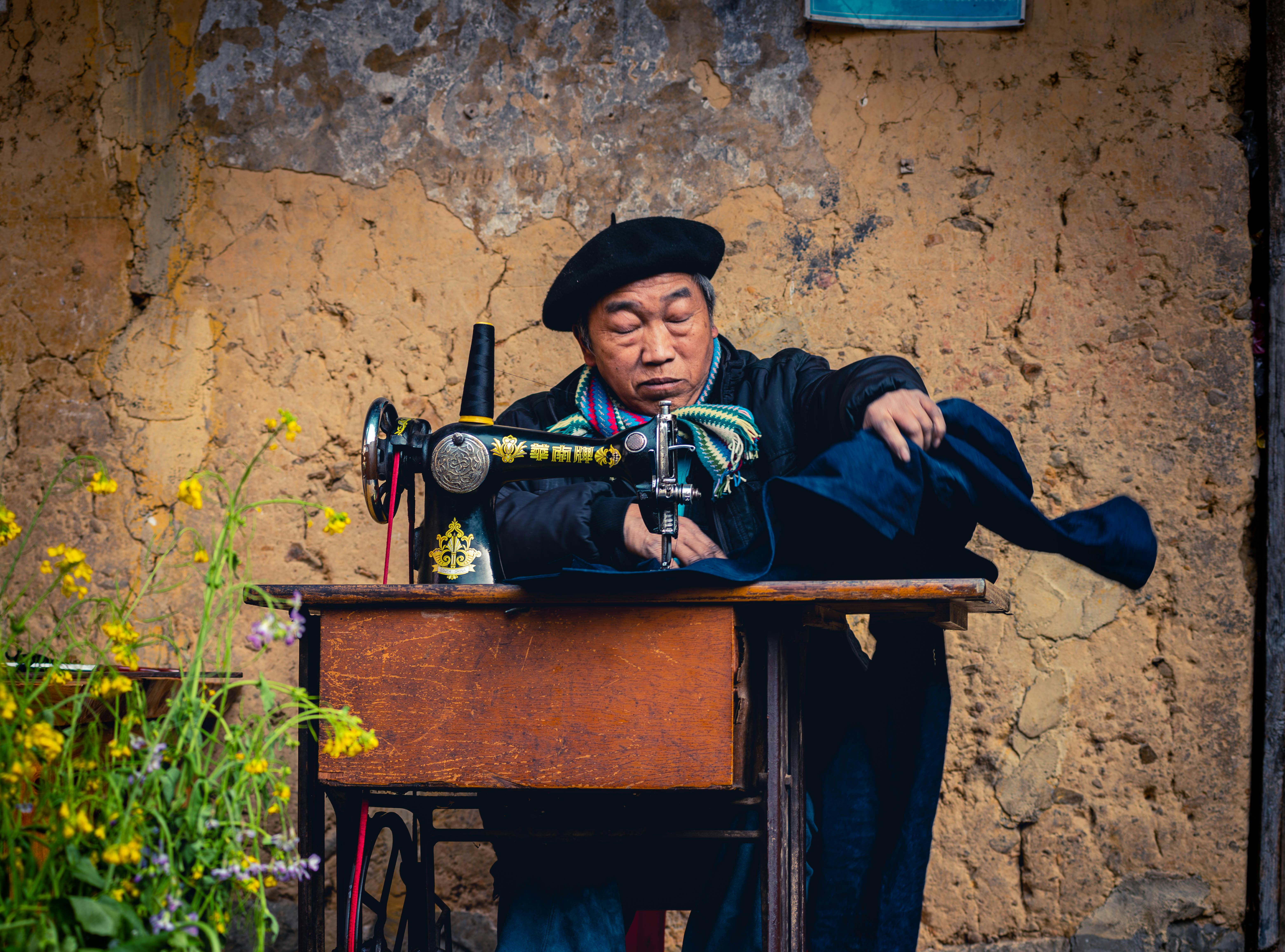 Traditional Tailor Sewing on Vintage Machine · Free Stock Photo