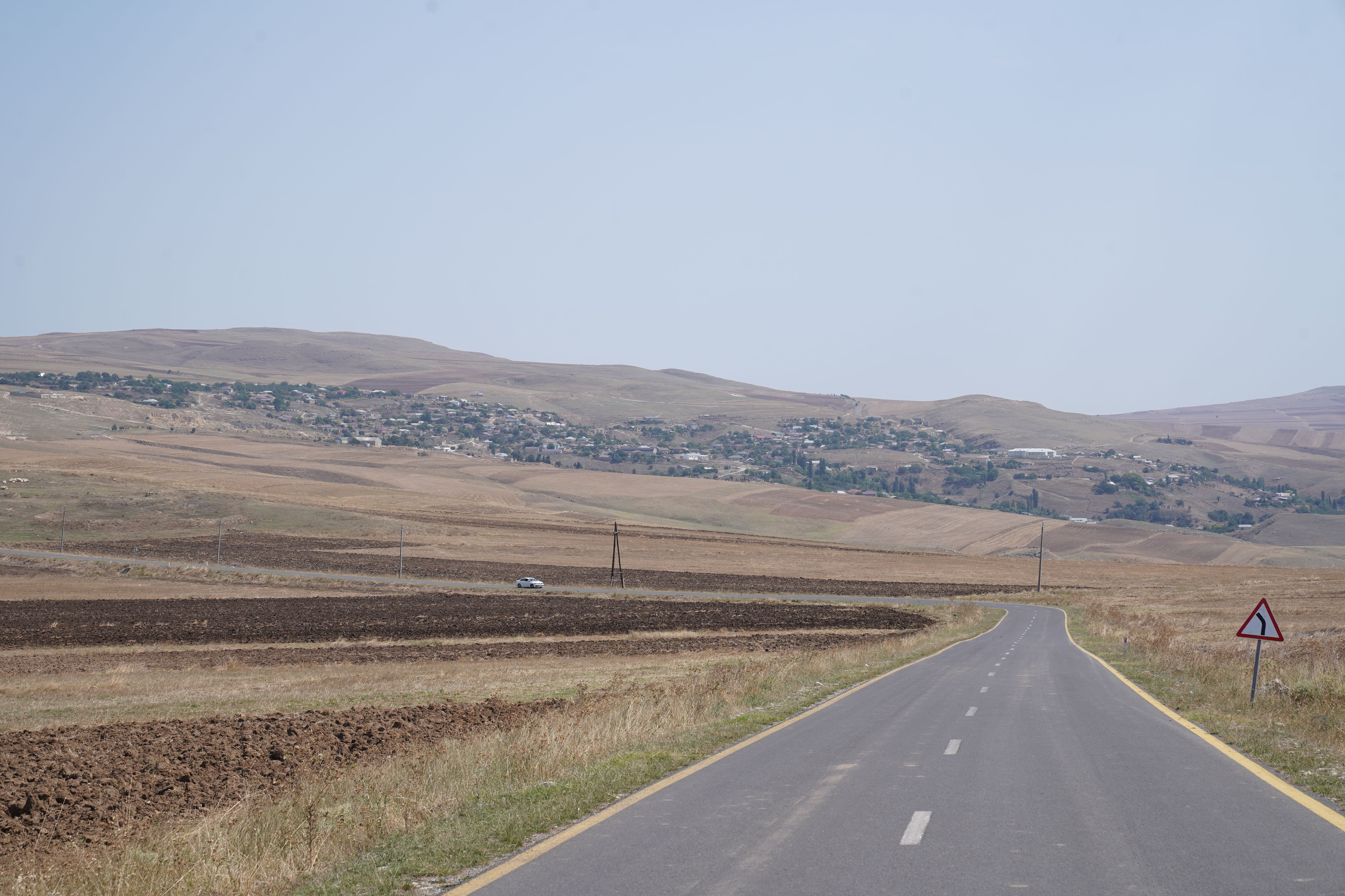 Open Road Stretching Through Arid Countryside · Free Stock Photo