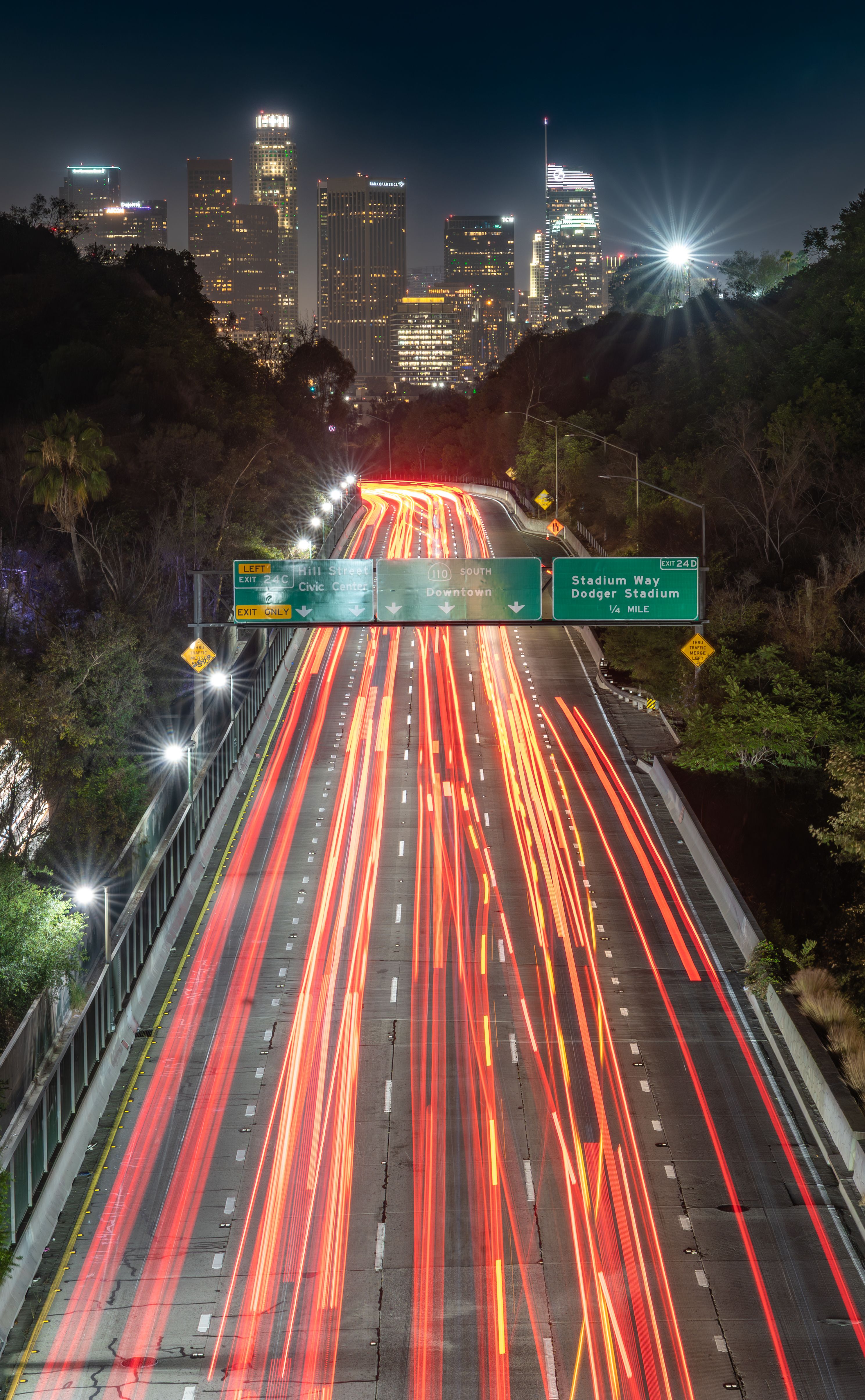 Night Traffic on Los Angeles Freeway with Skyline View · Free Stock Photo