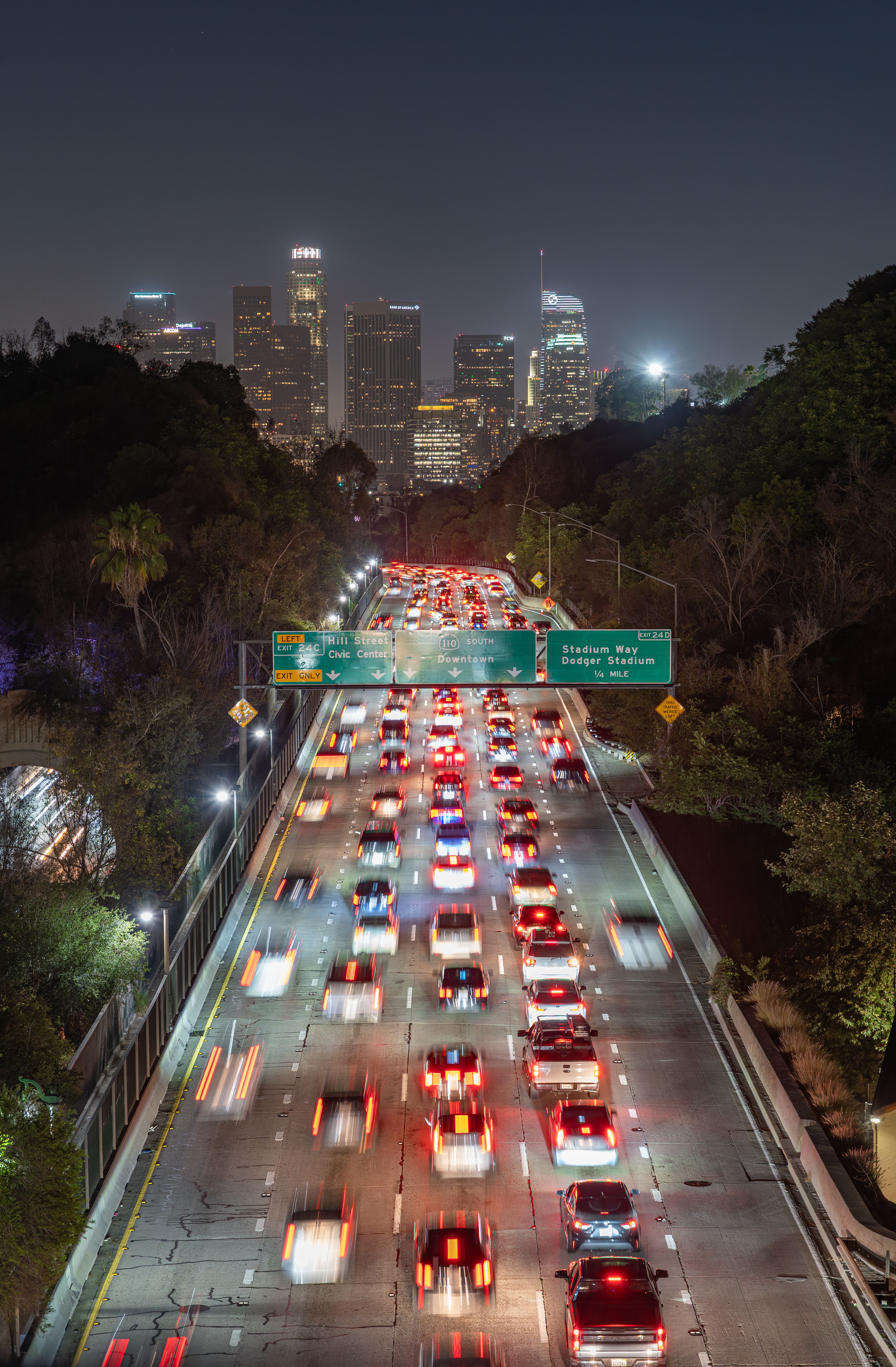 Night Traffic on Los Angeles Freeway with Skyline View · Free Stock Photo