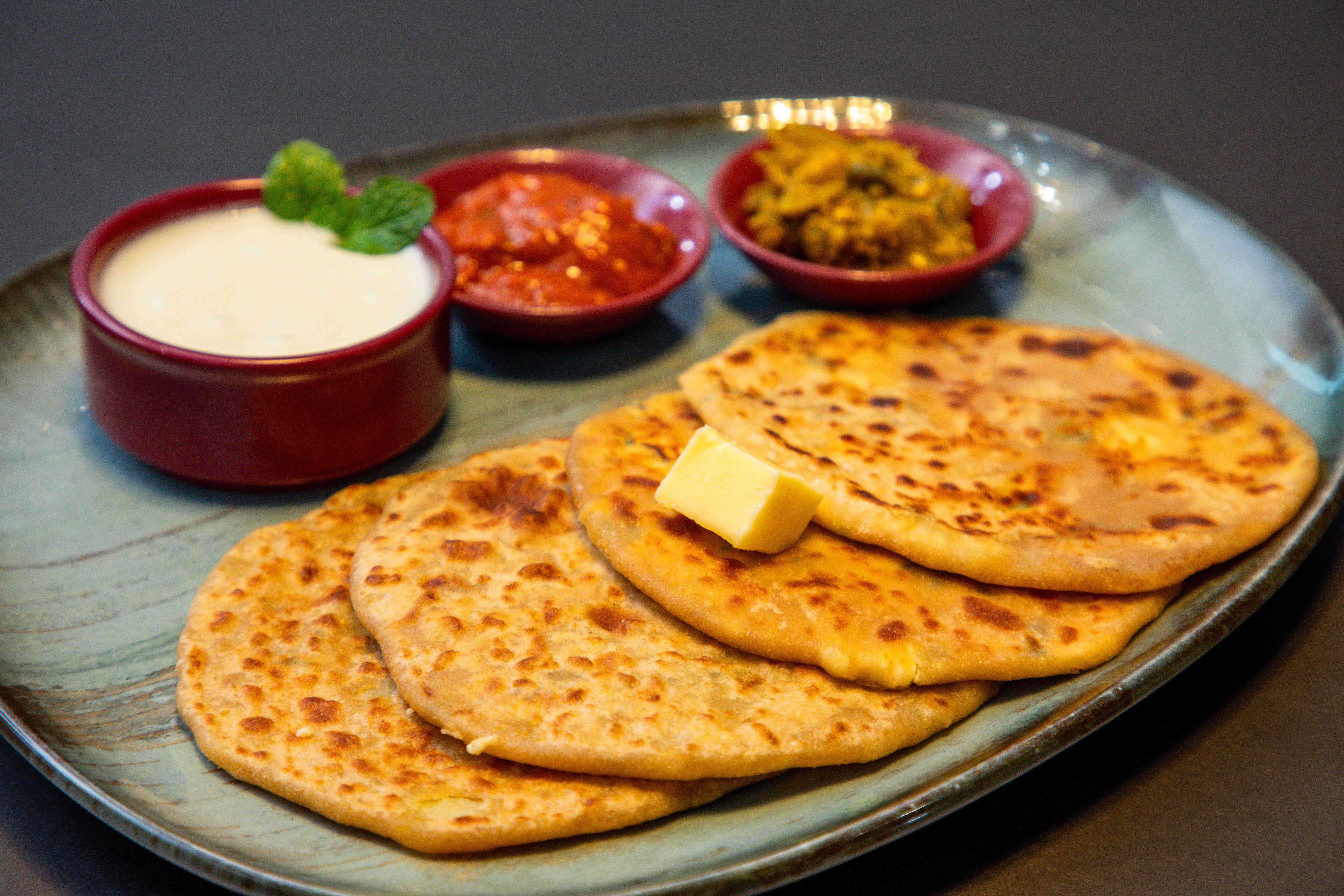 Delicious Indian Paratha with Condiments · Free Stock Photo