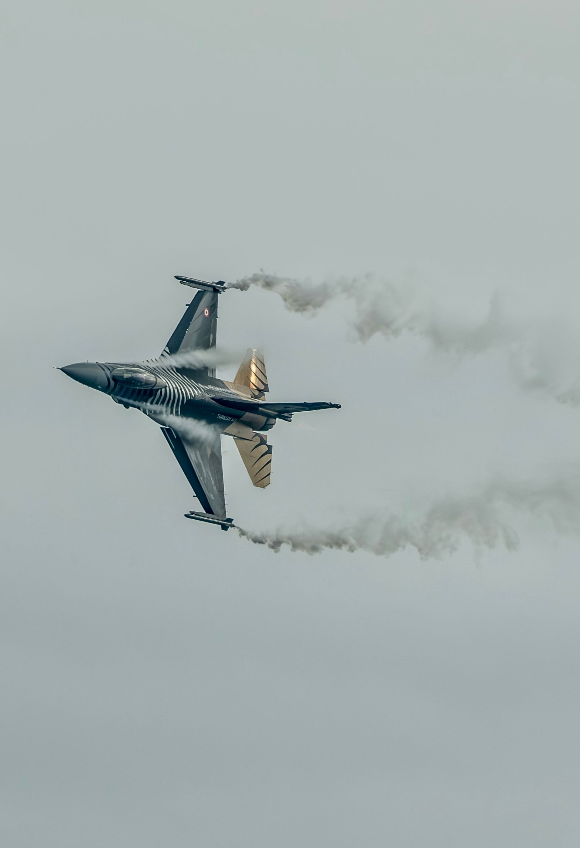 Fighter Jet Performing Aerial Maneuver in Cloudy Sky · Free Stock Photo