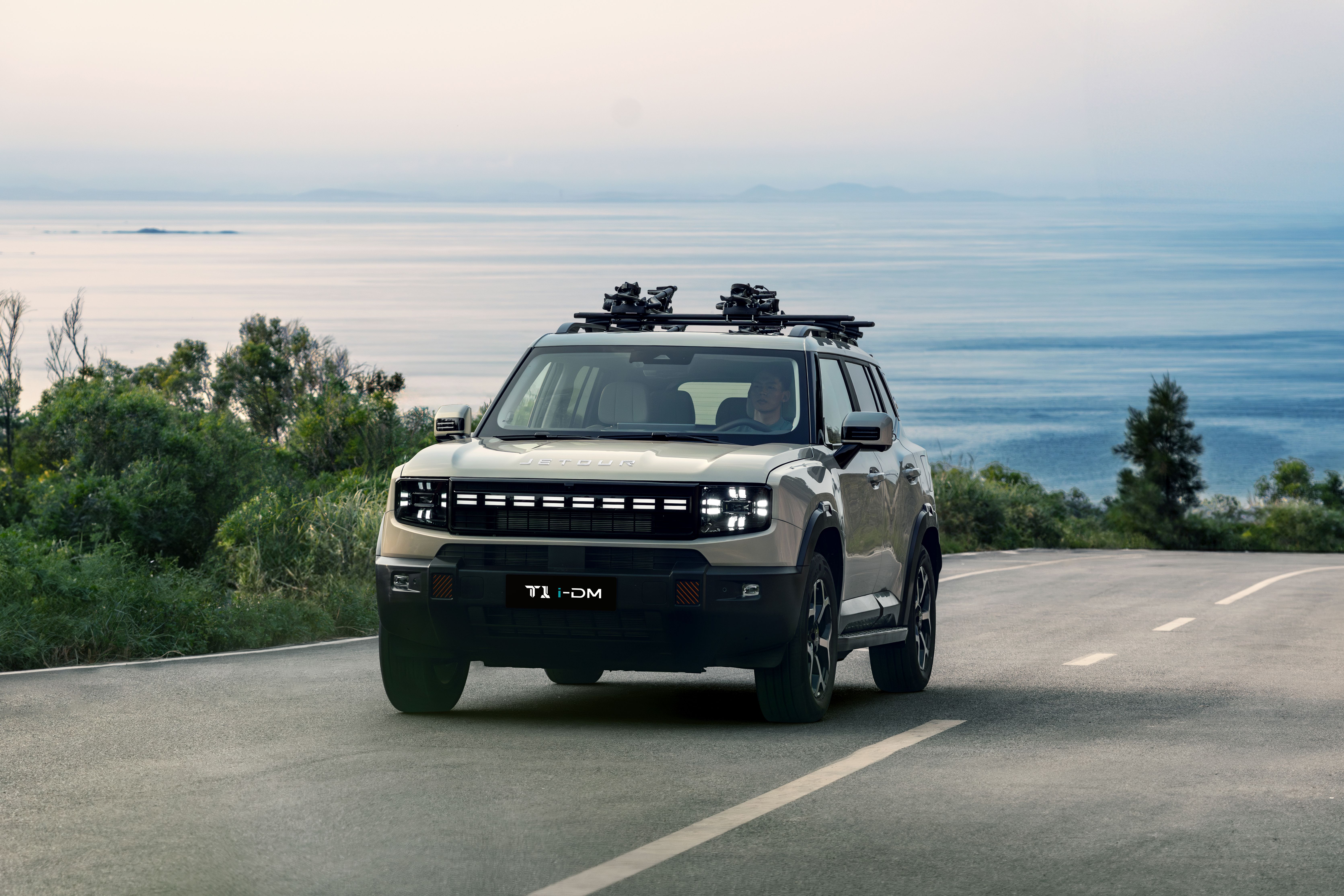 Modern SUV on Scenic Coastal Road · Free Stock Photo