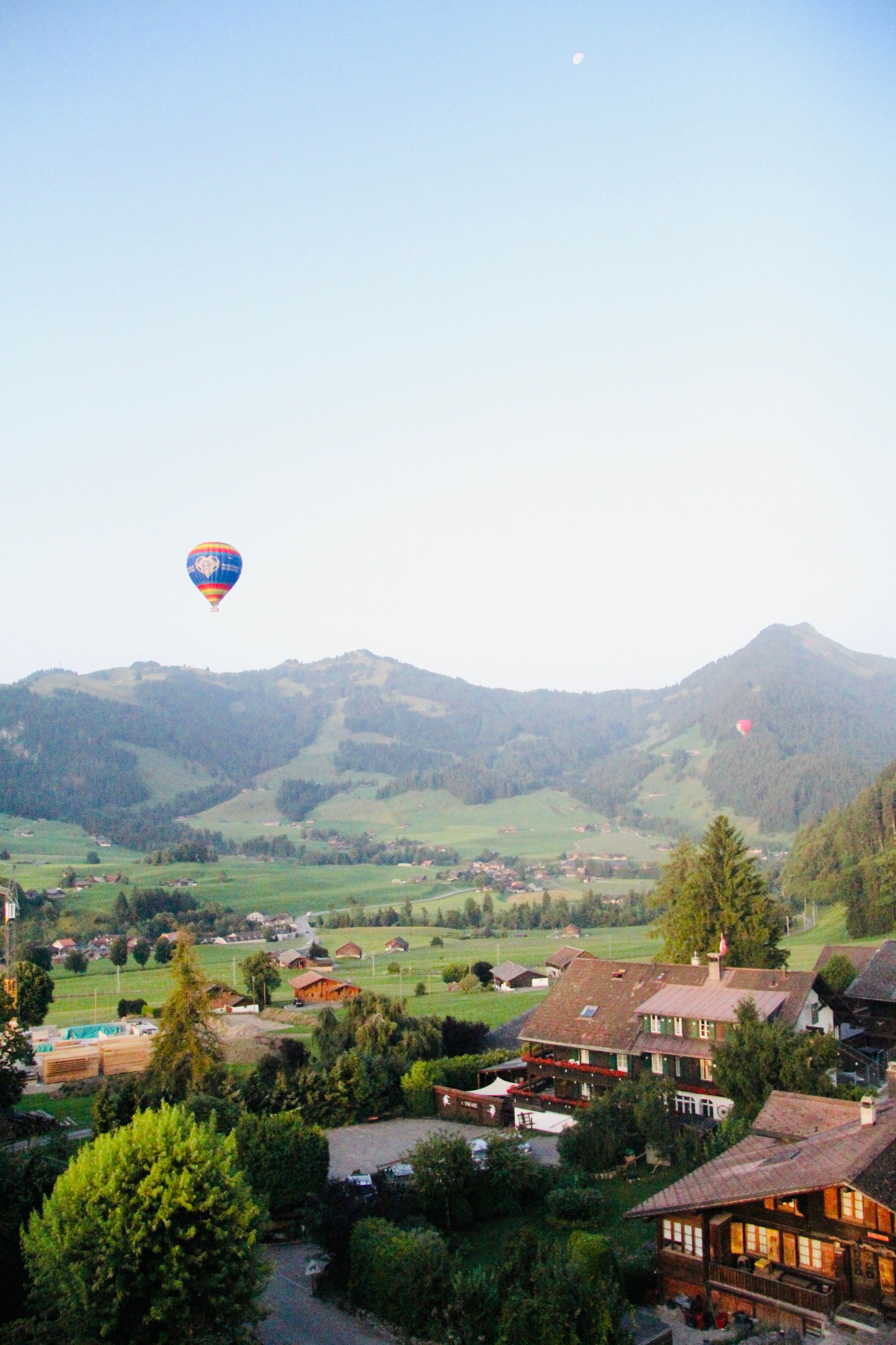 Scenic View of Hot Air Balloons Over Rural Landscape · Free Stock Photo
