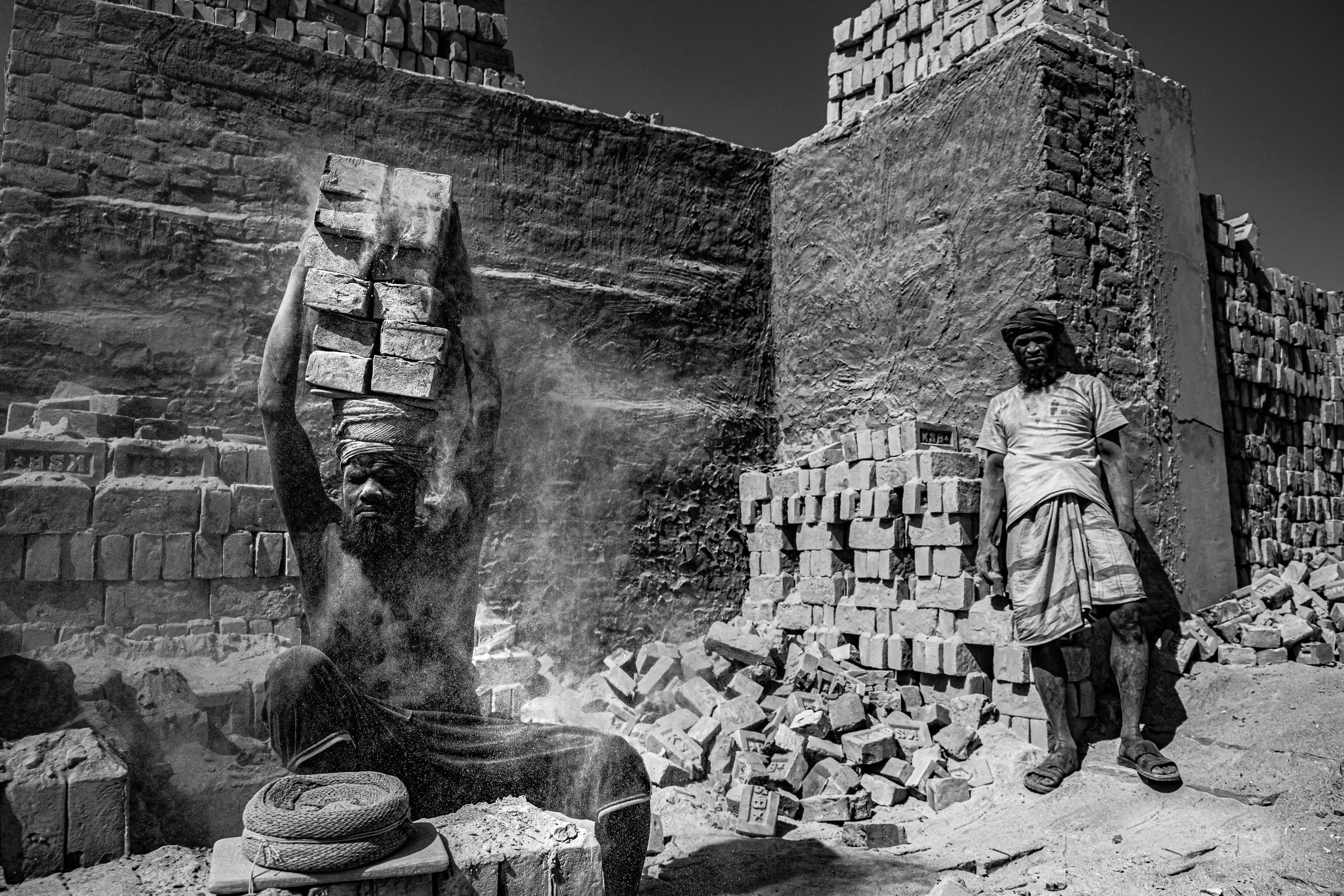 Laborers Working in Brick Factory: Monochrome Portrait · Free Stock Photo