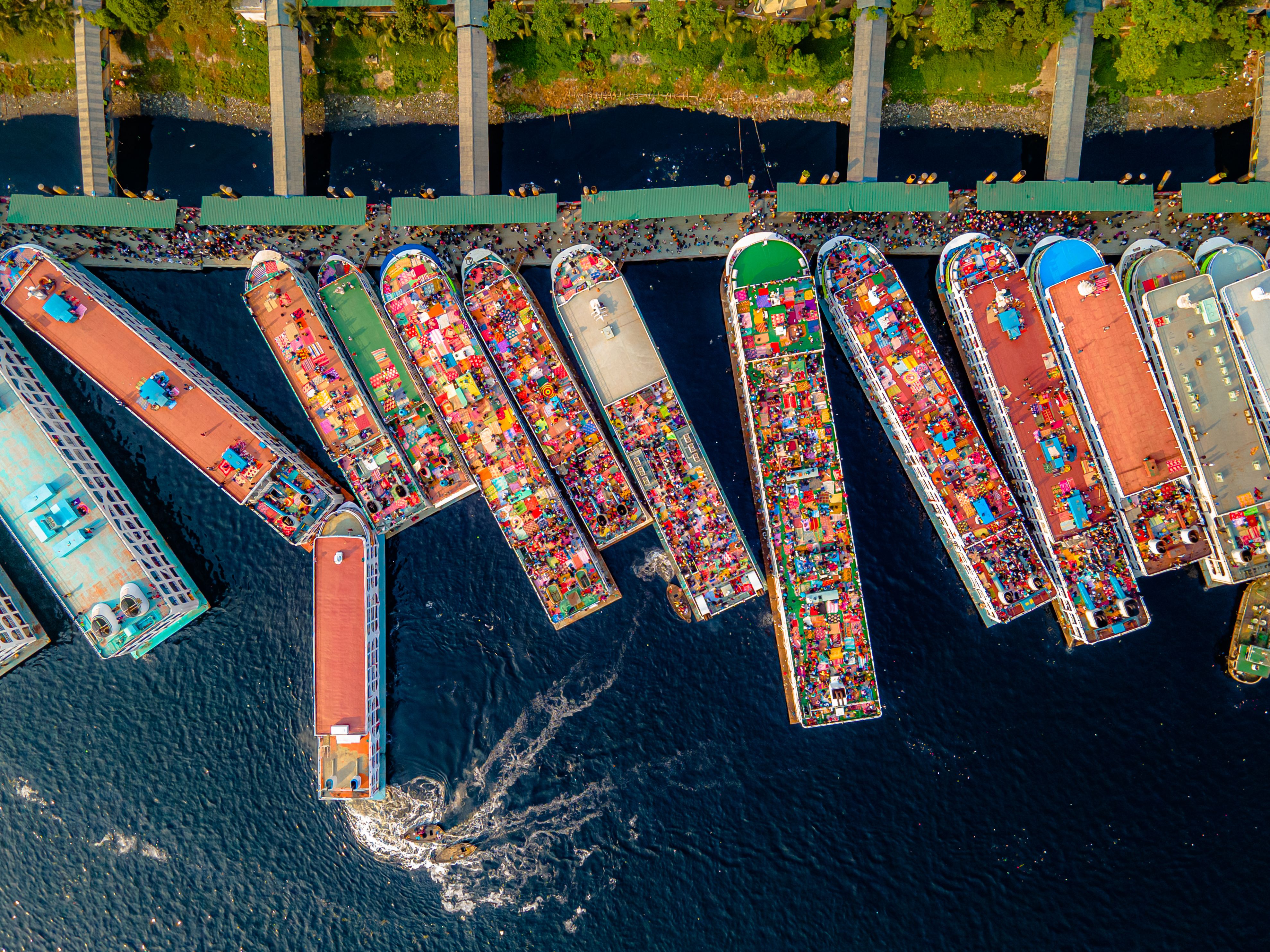 Aerial View of Colorful Boats Docked at a Busy Port · Free Stock Photo