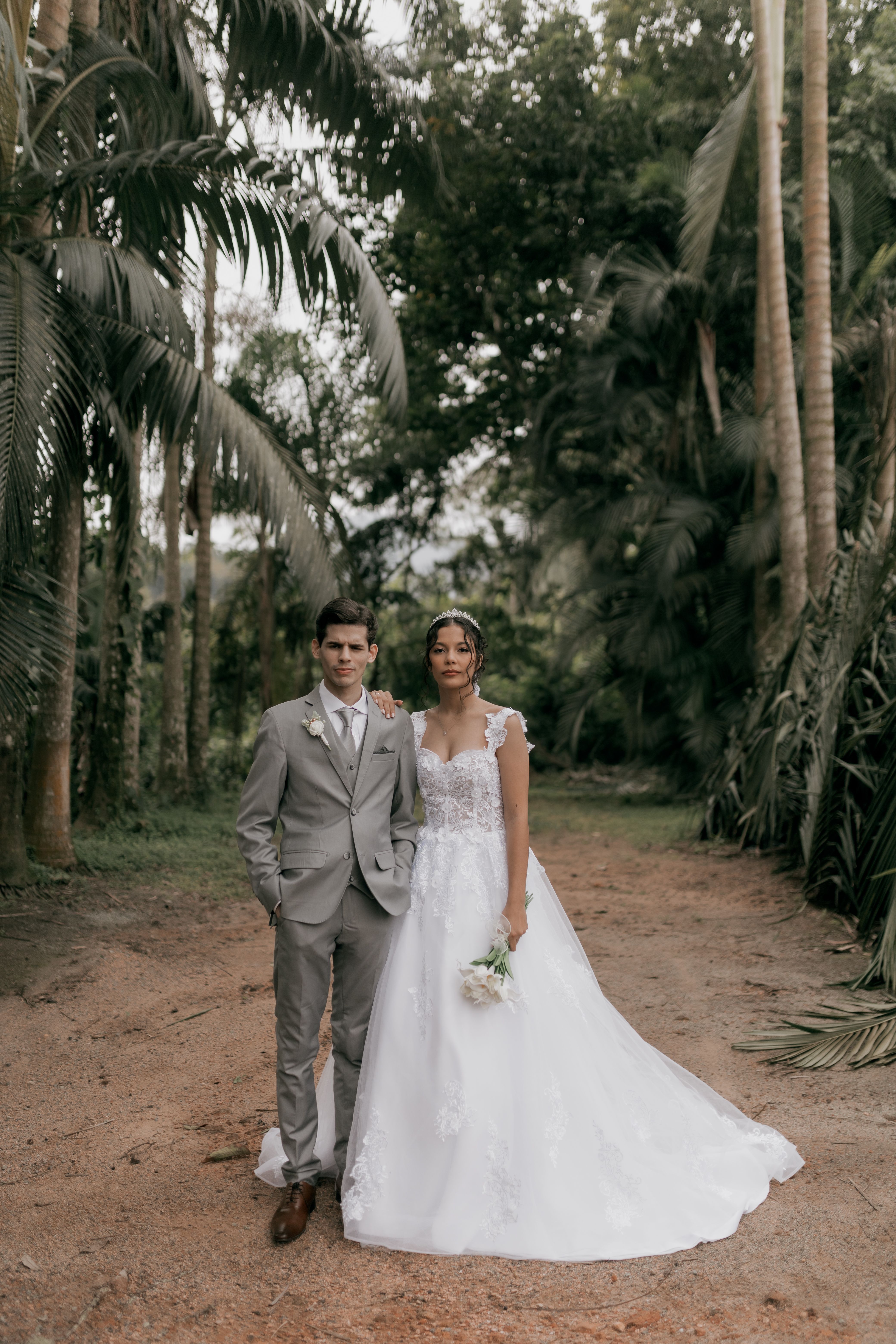 Elegant Outdoor Wedding Portrait in Tropical Setting · Free Stock Photo