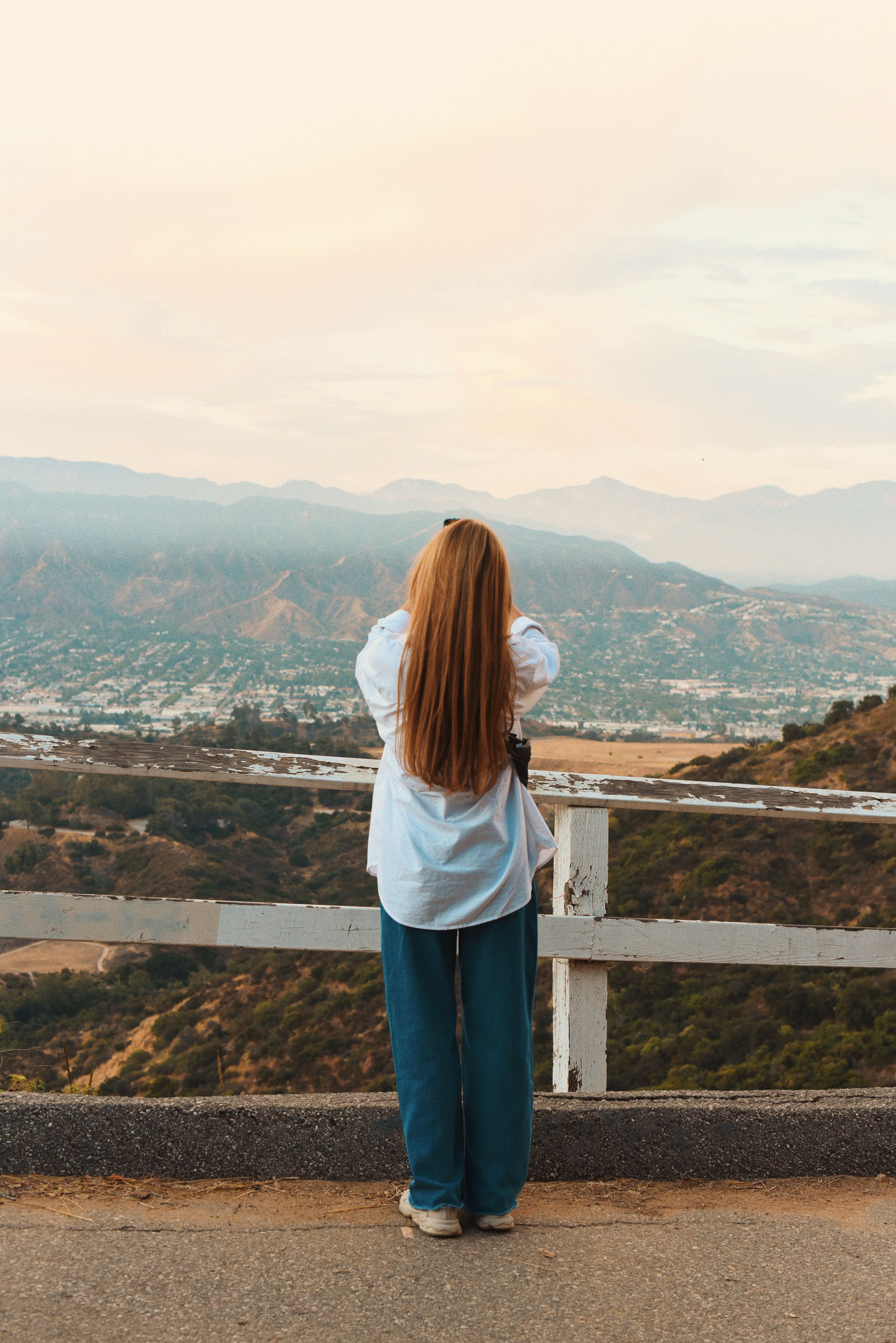 Person admiring Los Angeles landscape at sunrise · Free Stock Photo