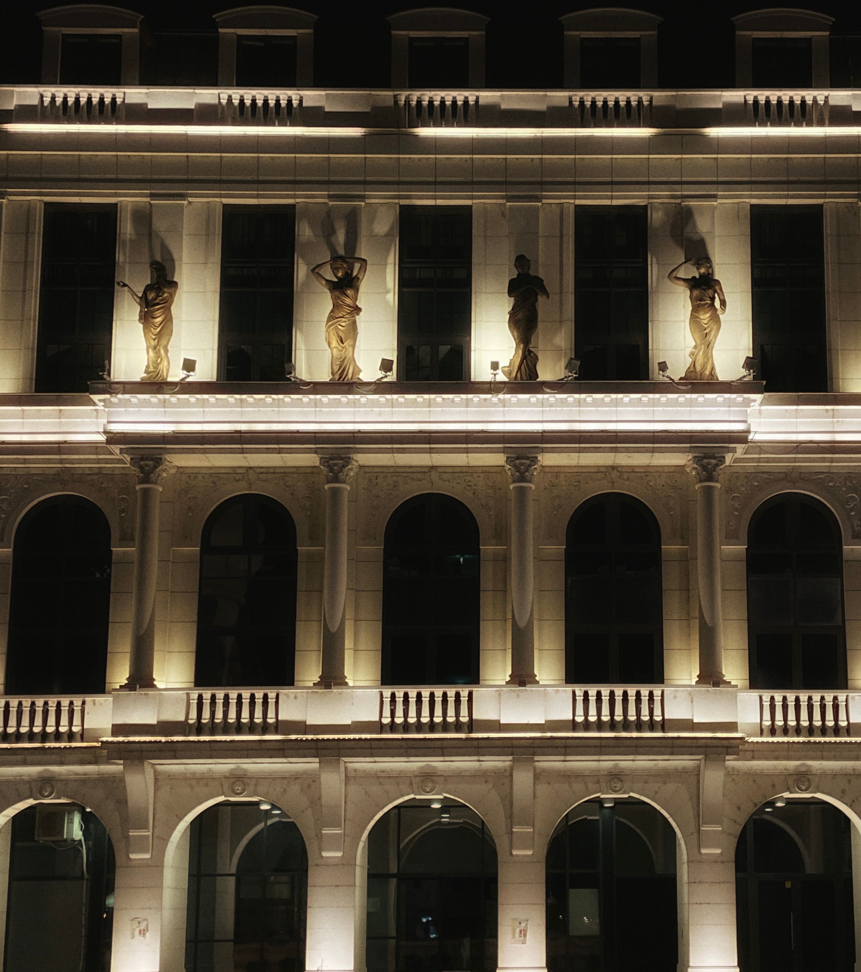 Illuminated Architecture with Classical Sculptures at Night · Free ...