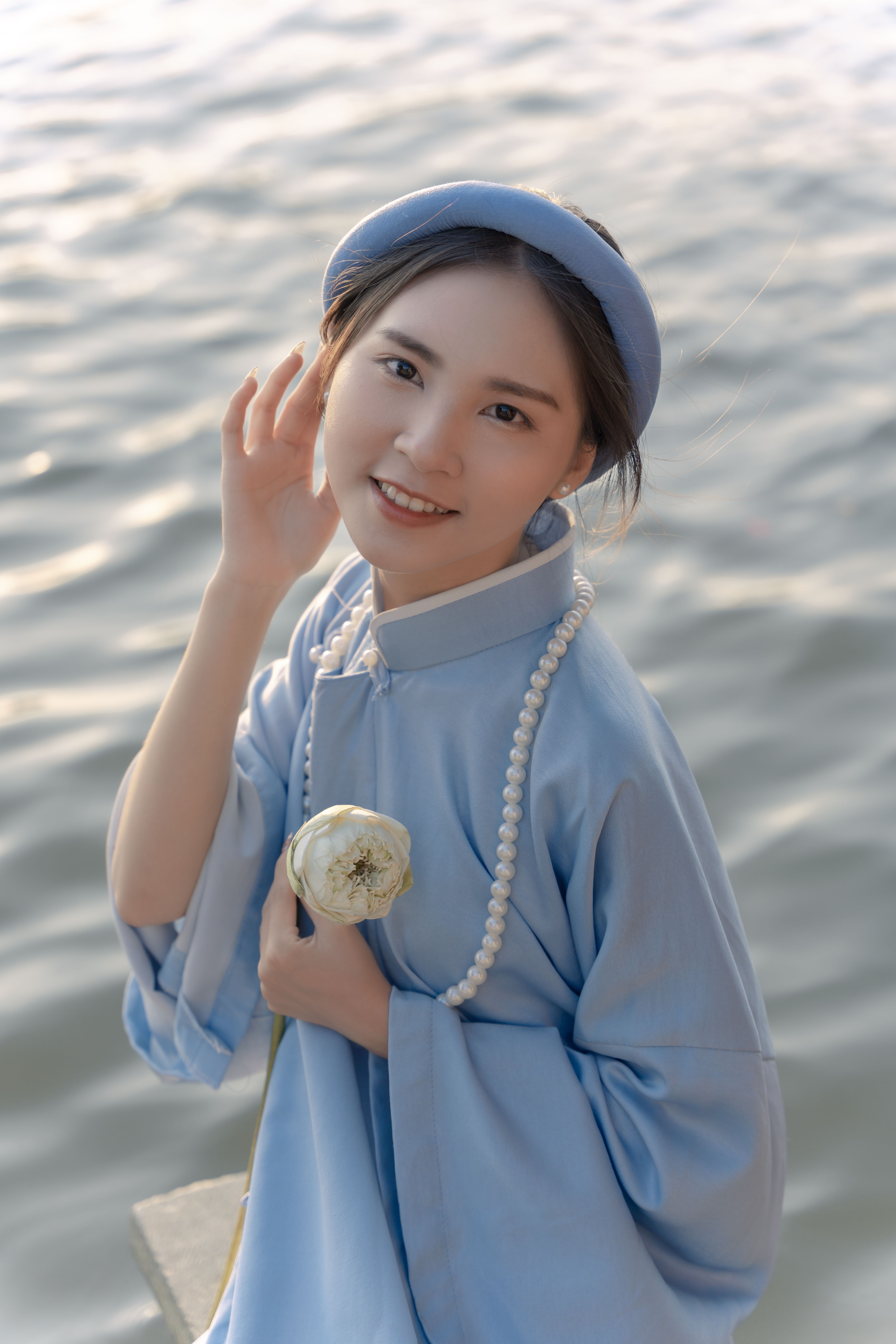 Young Woman in Blue Traditional Dress by Water · Free Stock Photo