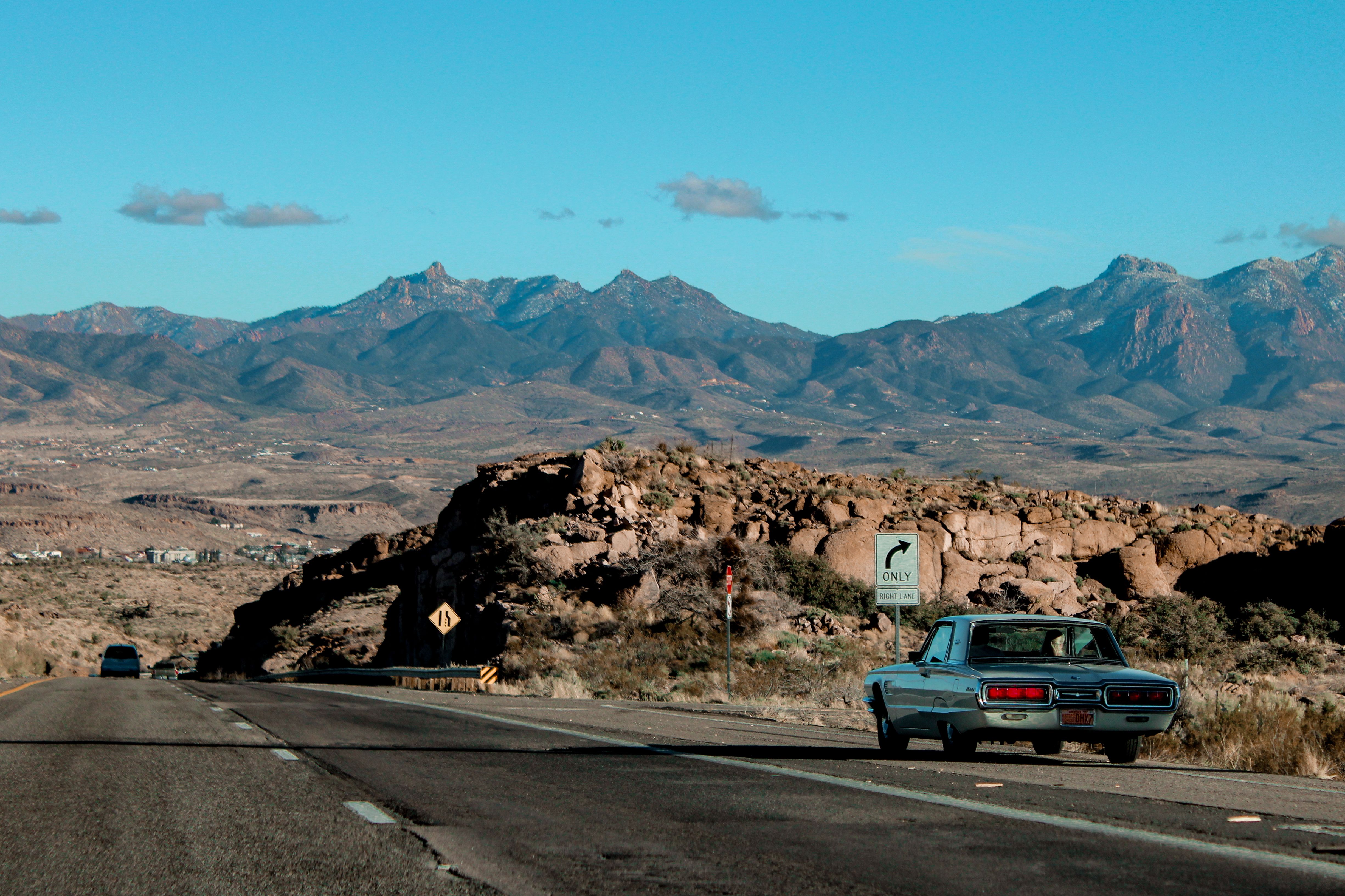 Classic Car on Scenic Arizona Desert Highway · Free Stock Photo