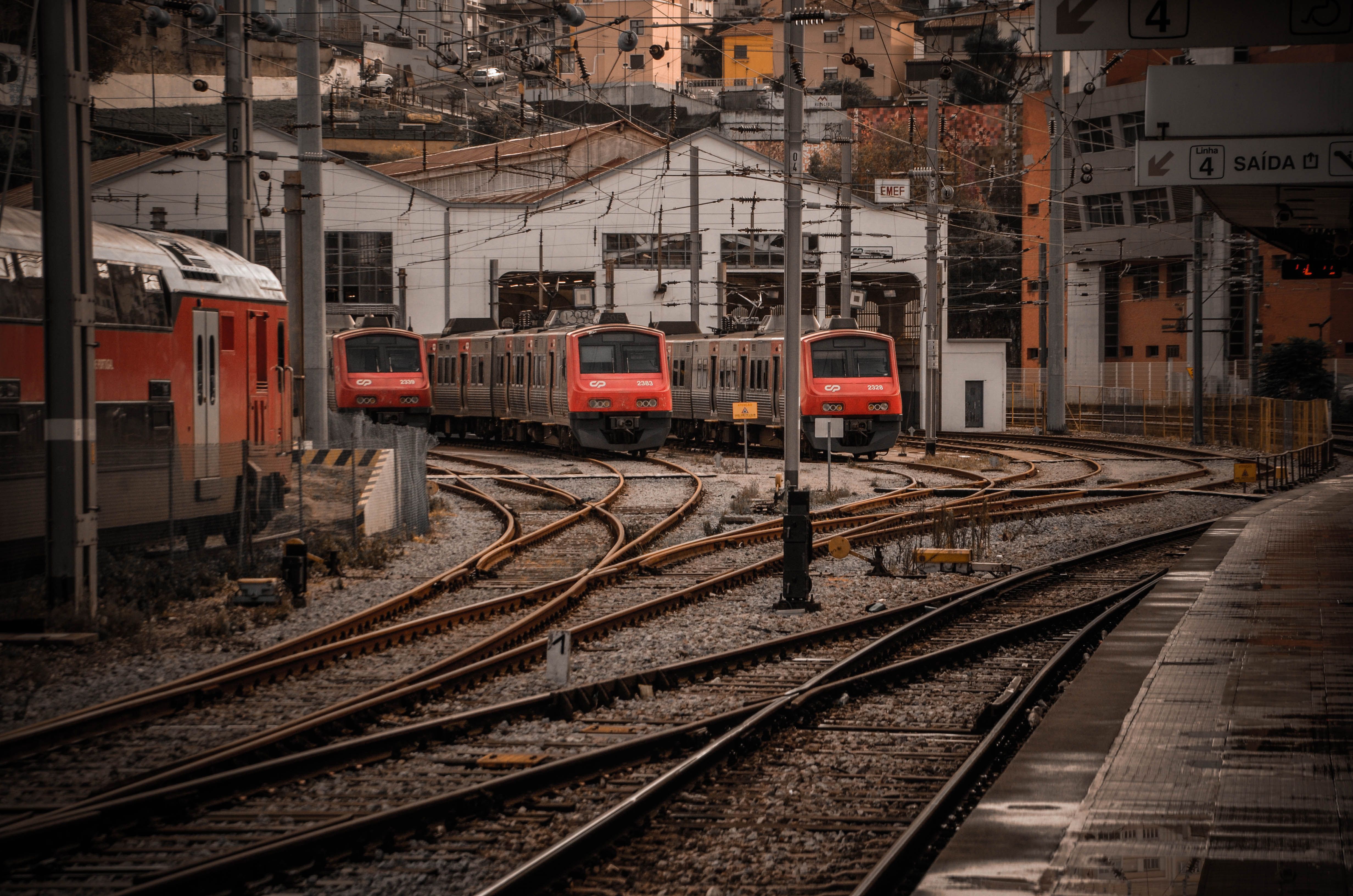 Busy Urban Train Station with Multiple Tracks and Trains · Free Stock Photo