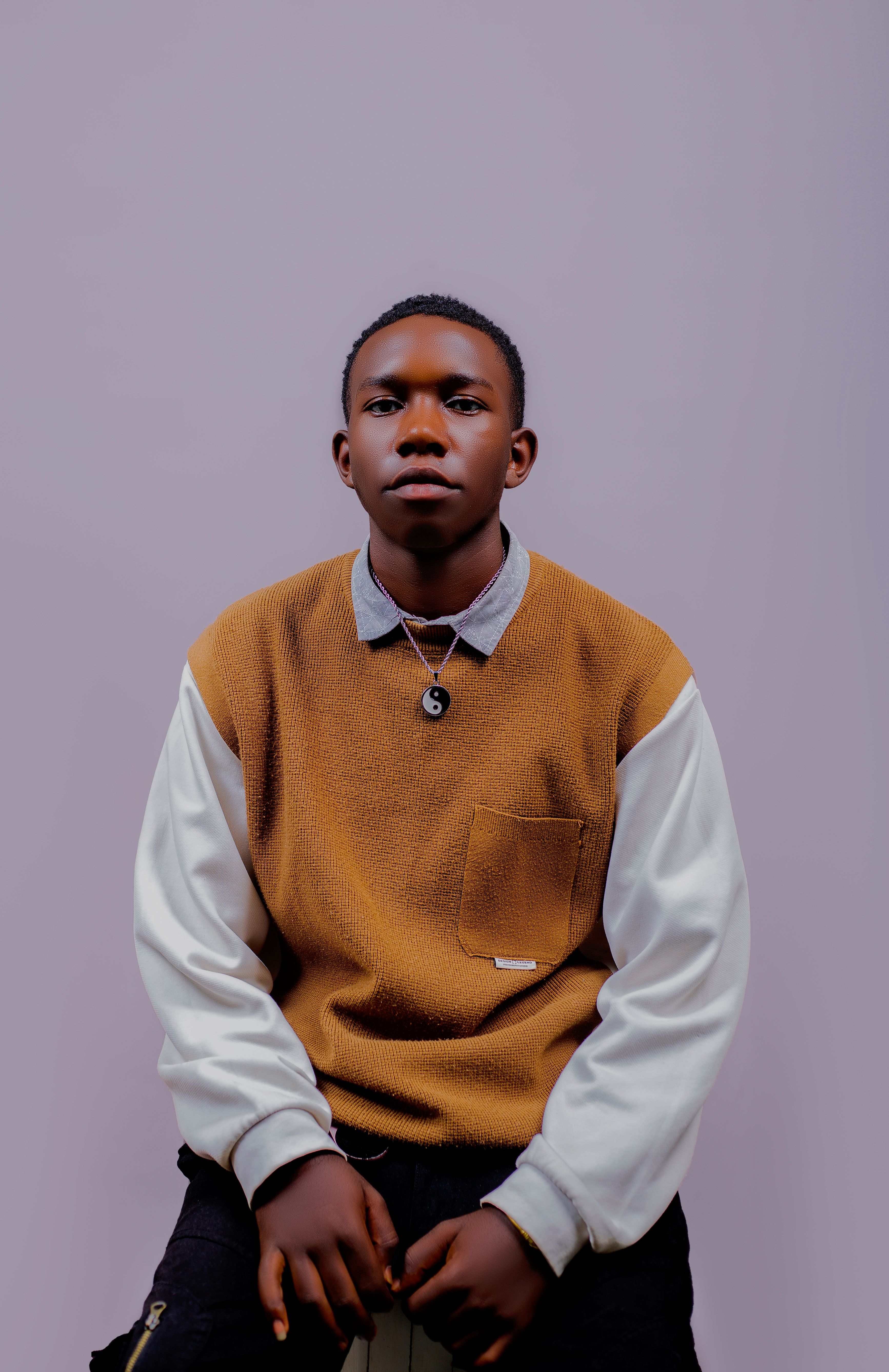 Young Man Posing on Green Studio Background · Free Stock Photo