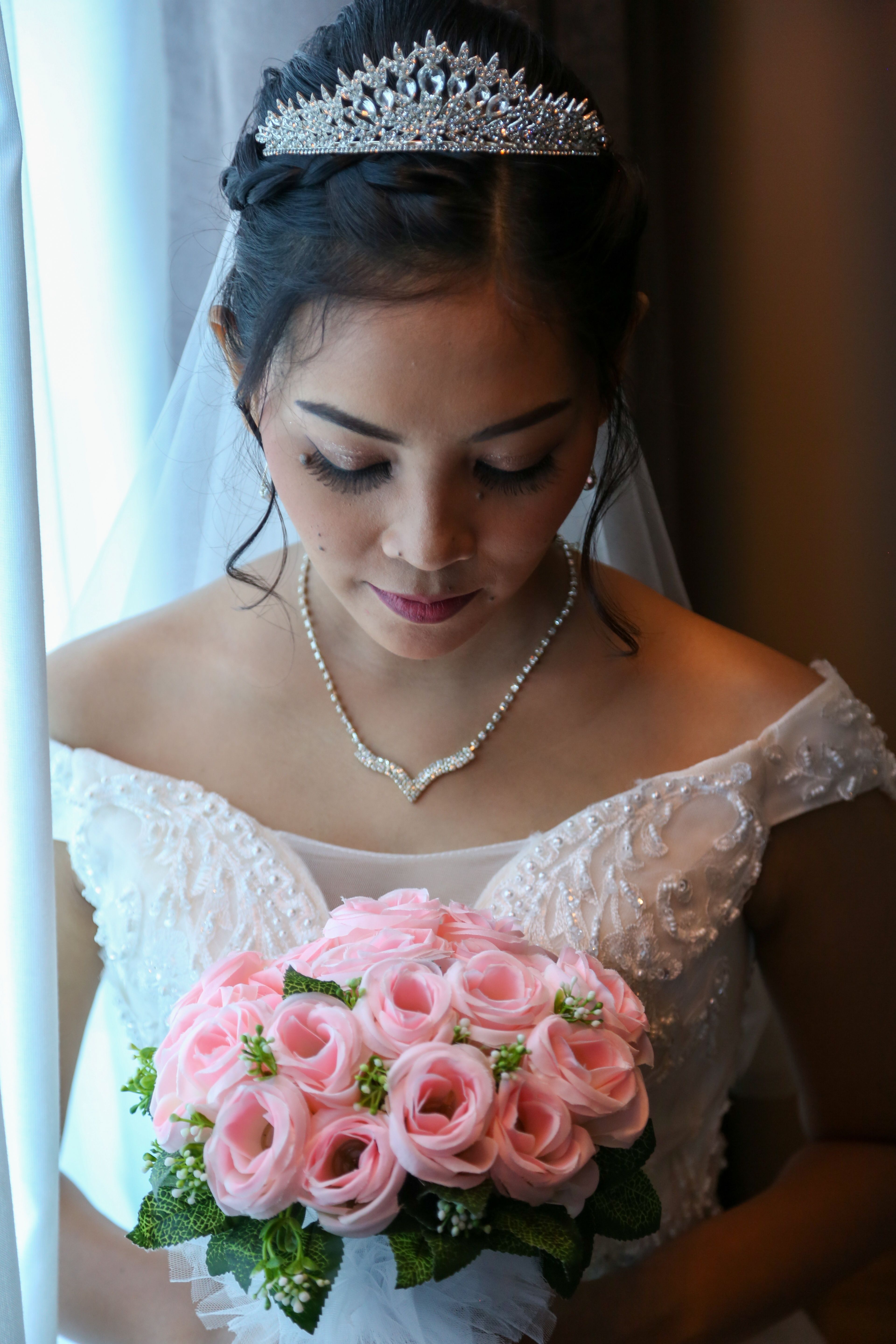 Elegant Bride Holding Pink Rose Bouquet · Free Stock Photo