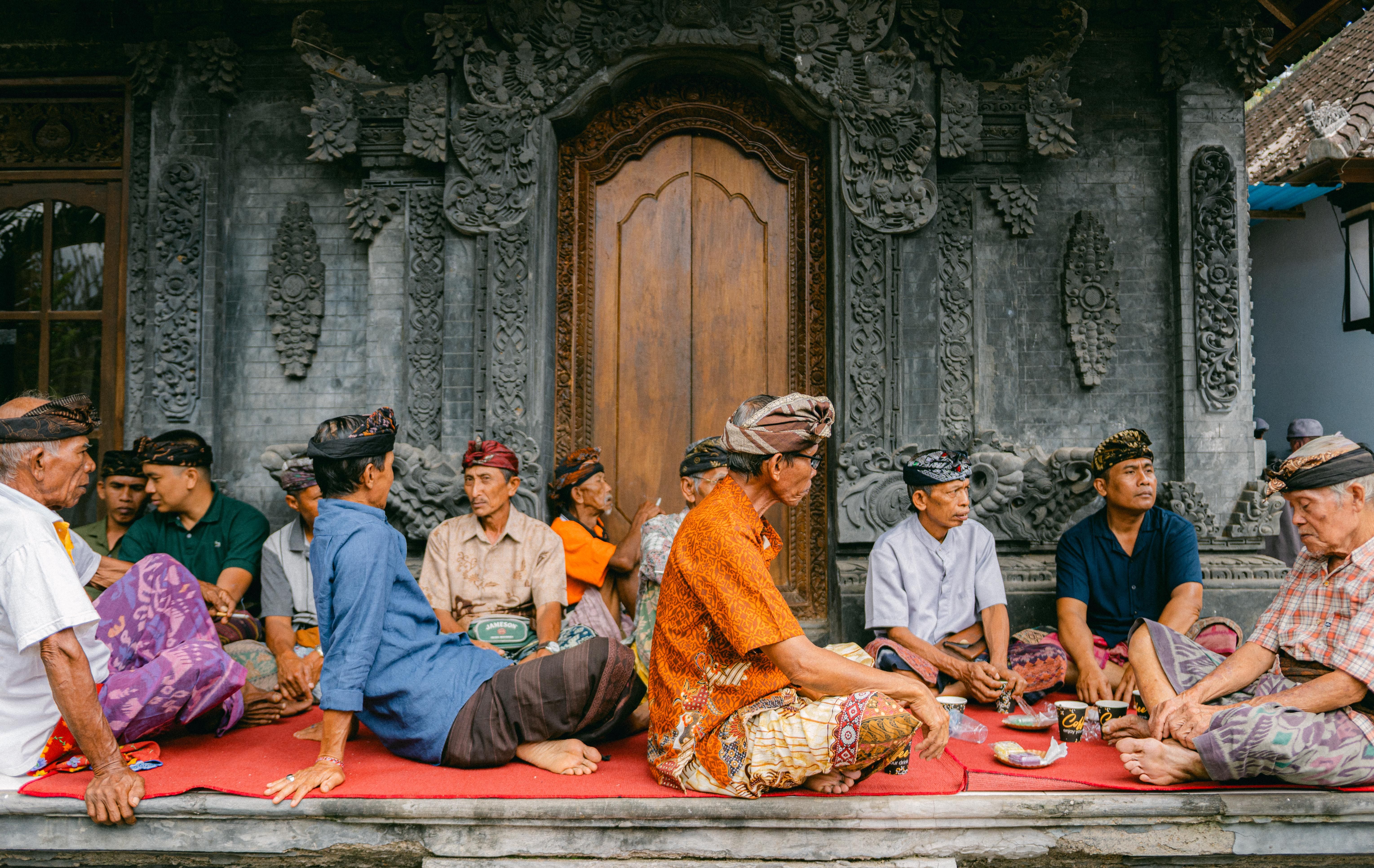 Balinese Men Gathering in Traditional Attire · Free Stock Photo