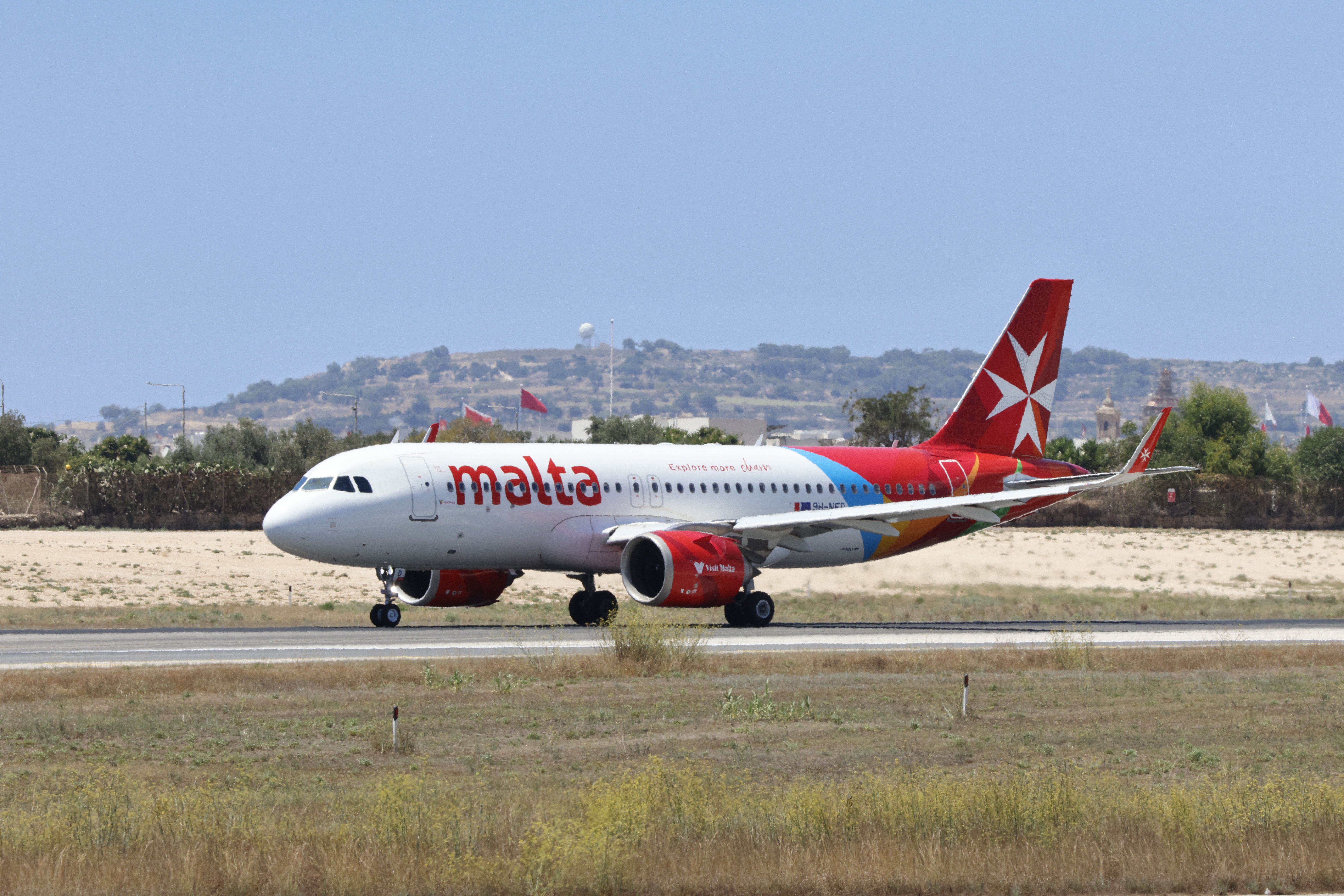 Air Malta Aircraft on Runway at Airport · Free Stock Photo