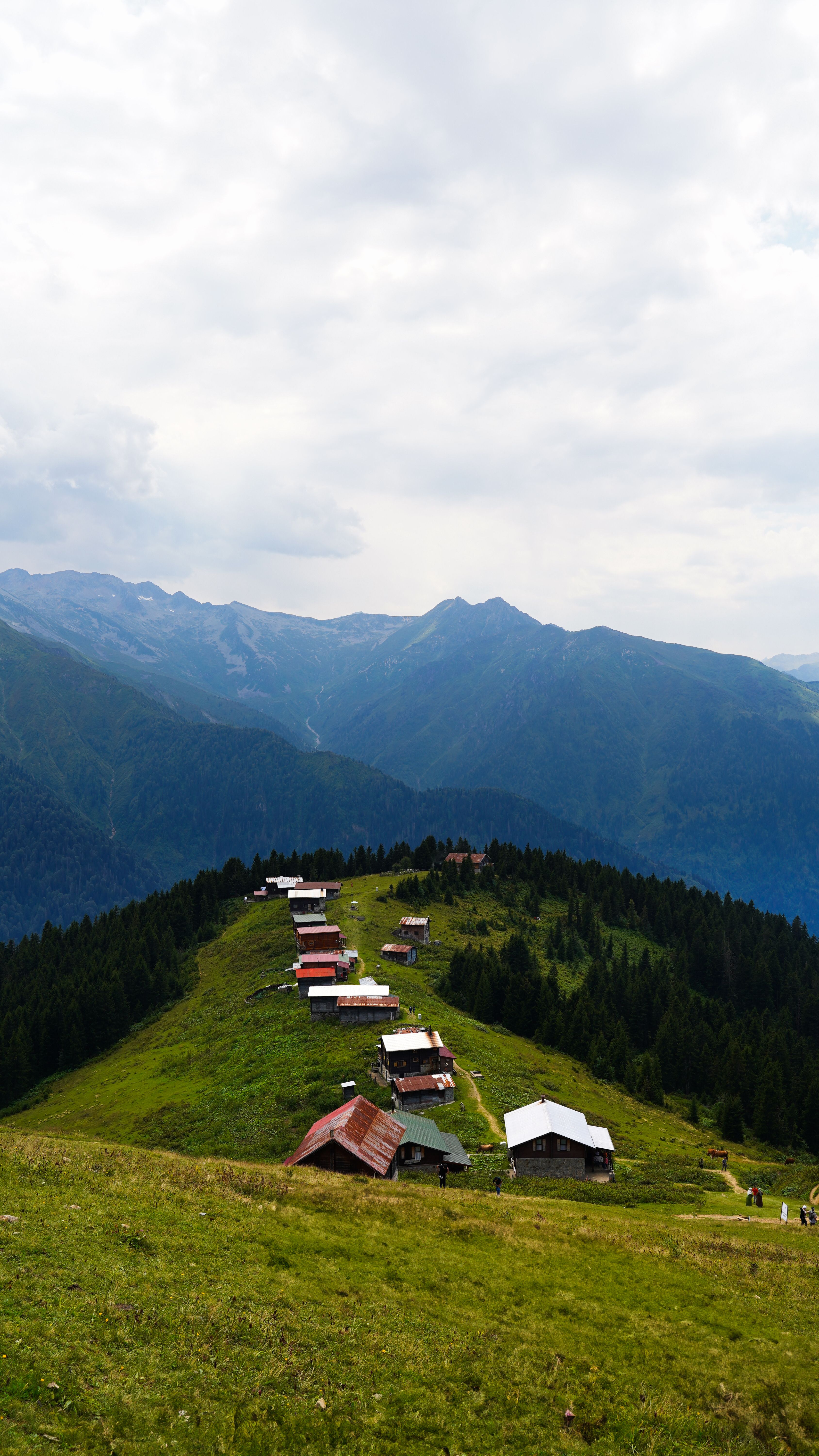 Scenic Mountain Village Overlooking Lush Valleys · Free Stock Photo