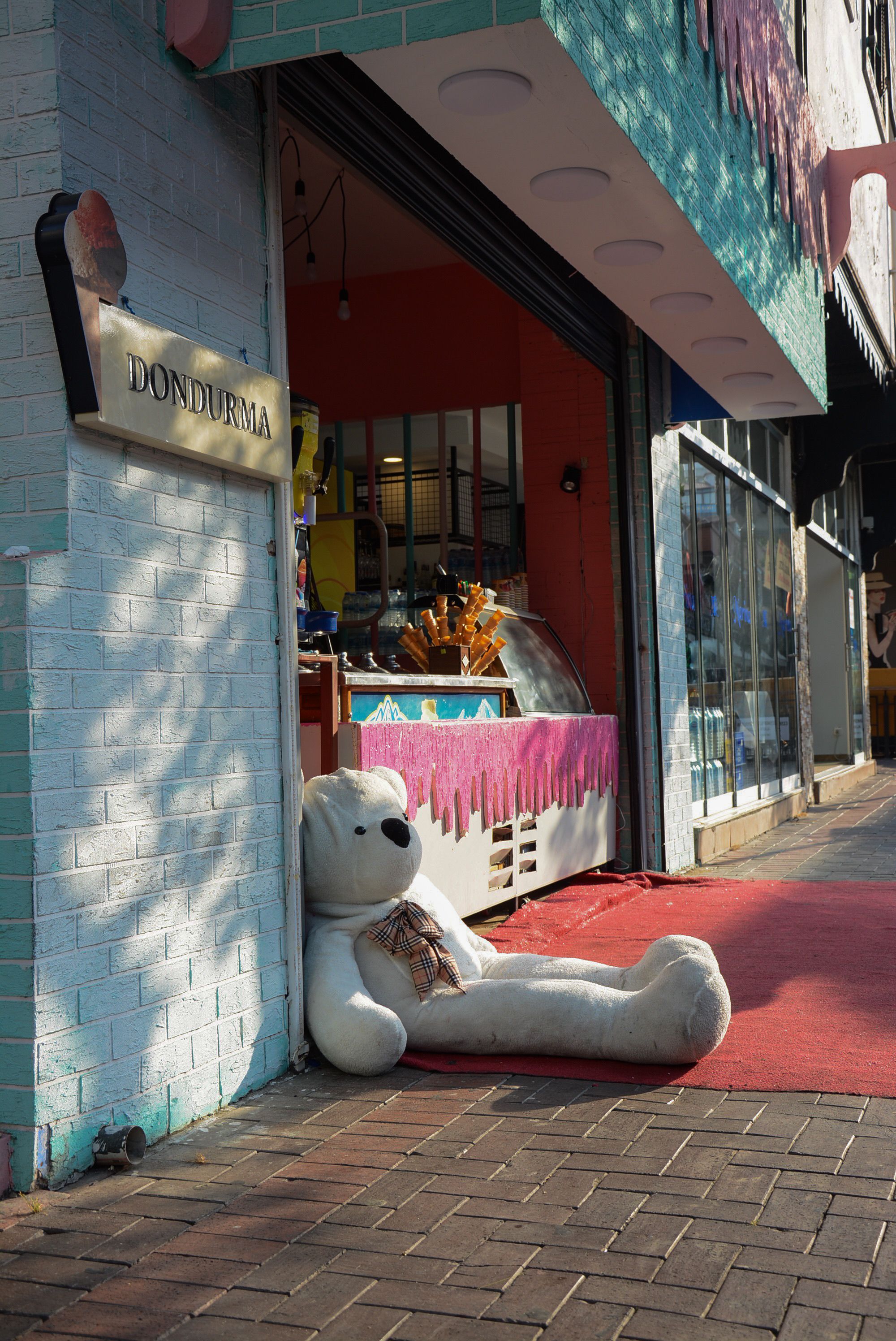 Giant Teddy Bear Outside Ice Cream Shopfront · Free Stock Photo