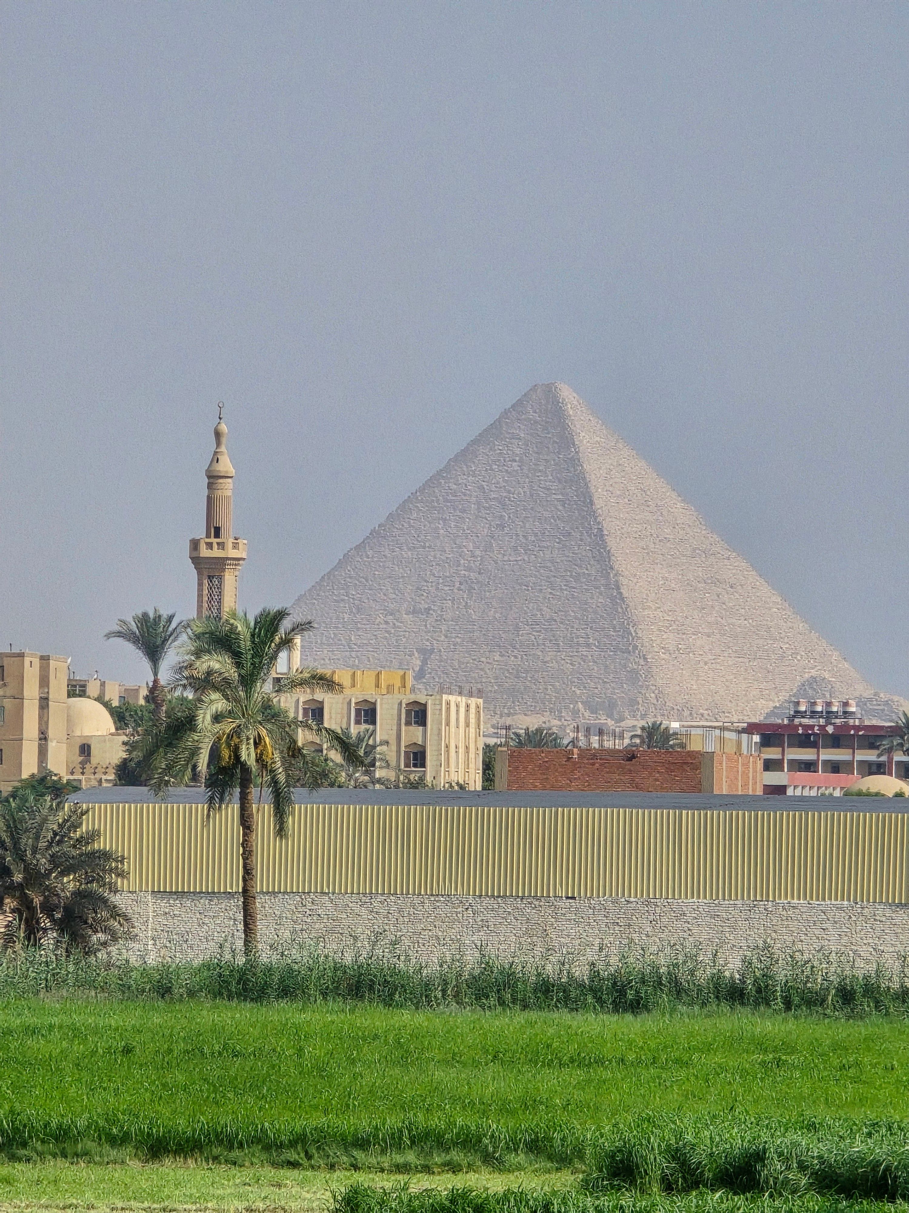The Great Pyramid and Cairo Skyline · Free Stock Photo