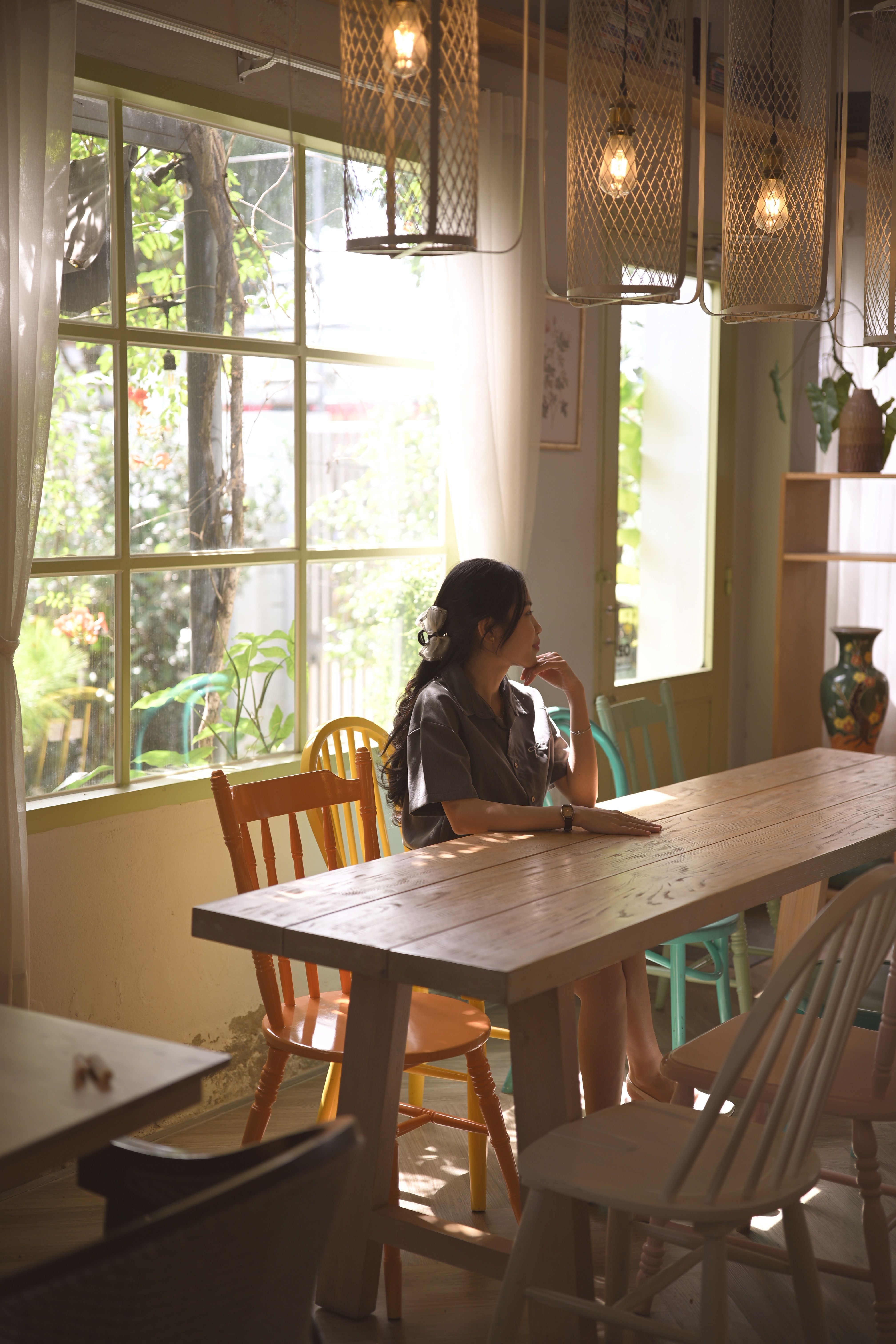 Serene Café Moment in Soft Sunlight Indoors · Free Stock Photo