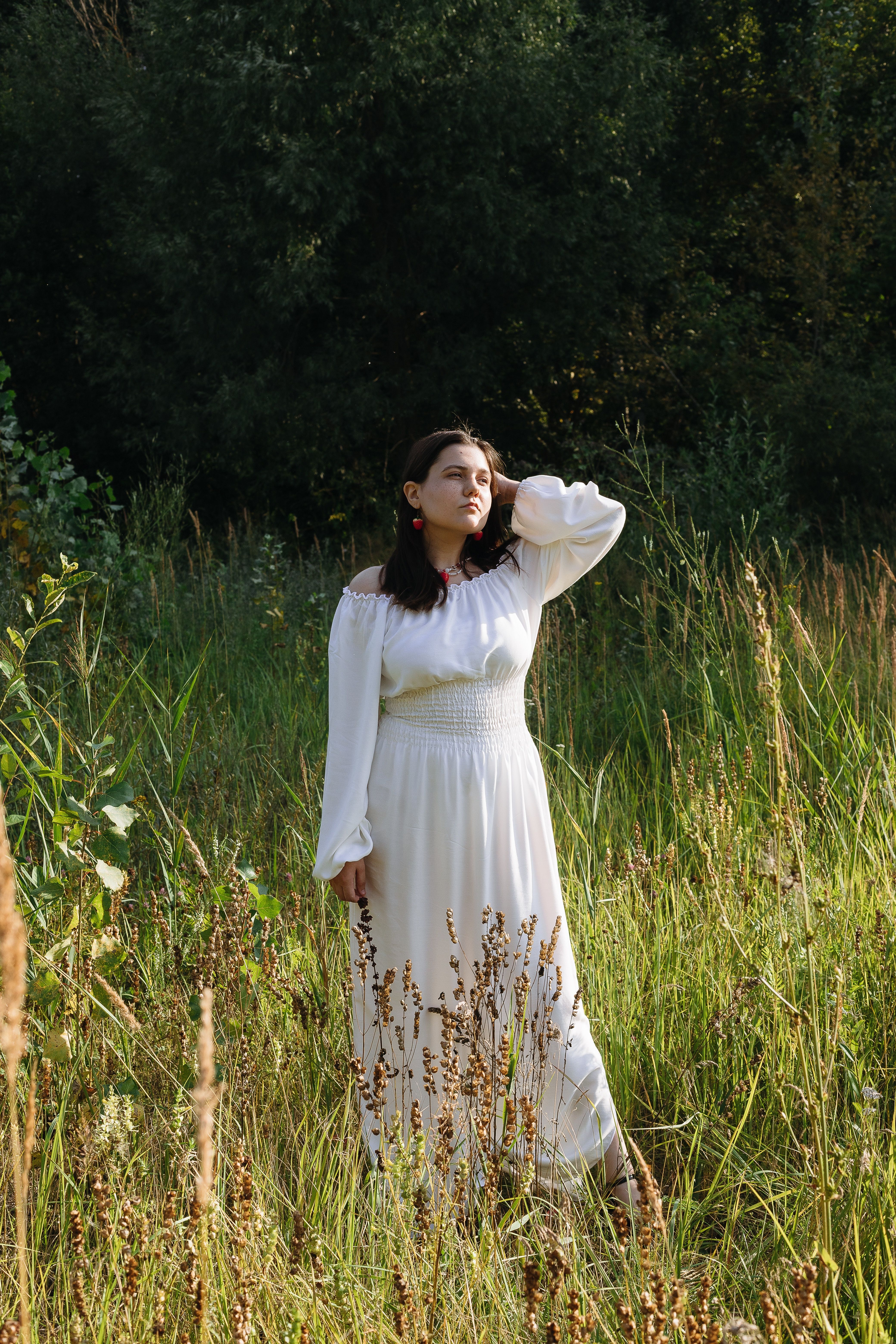 Woman in Blue Dress Enjoying Nature Outdoors · Free Stock Photo