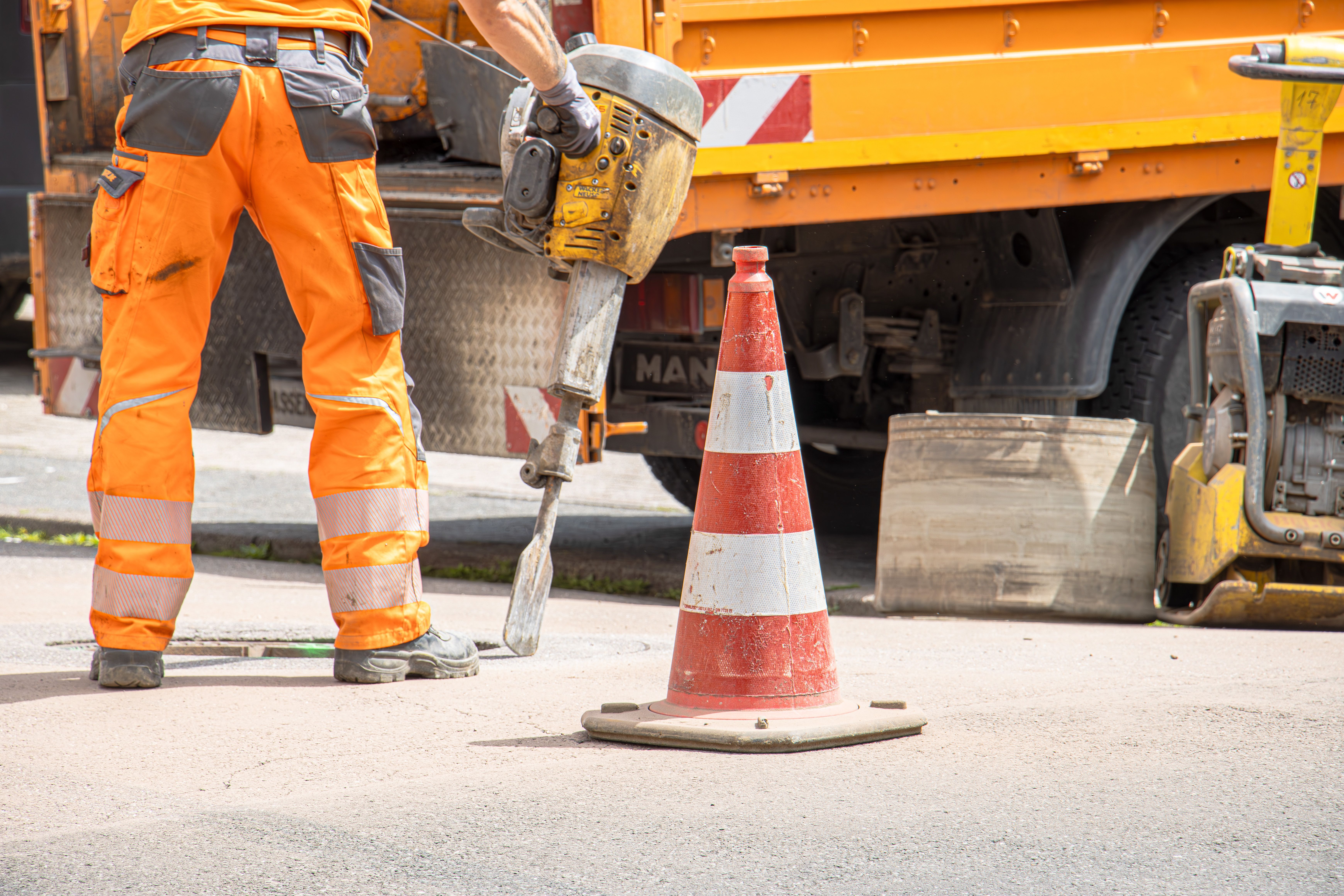 Construction workers measuring at job site outdoors · Free Stock Photo