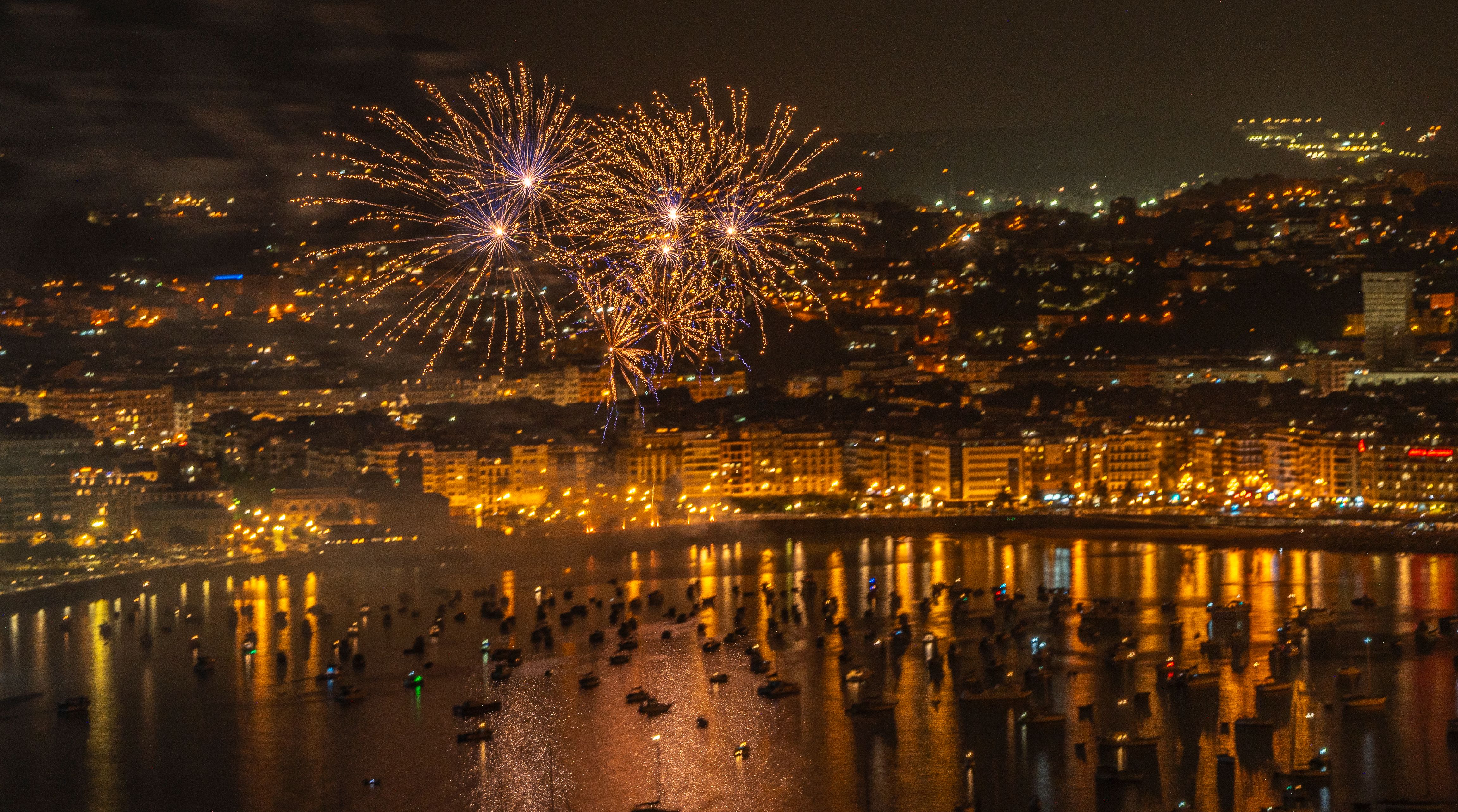 Fireworks Display over City Buildings during Night Time · Free Stock Photo