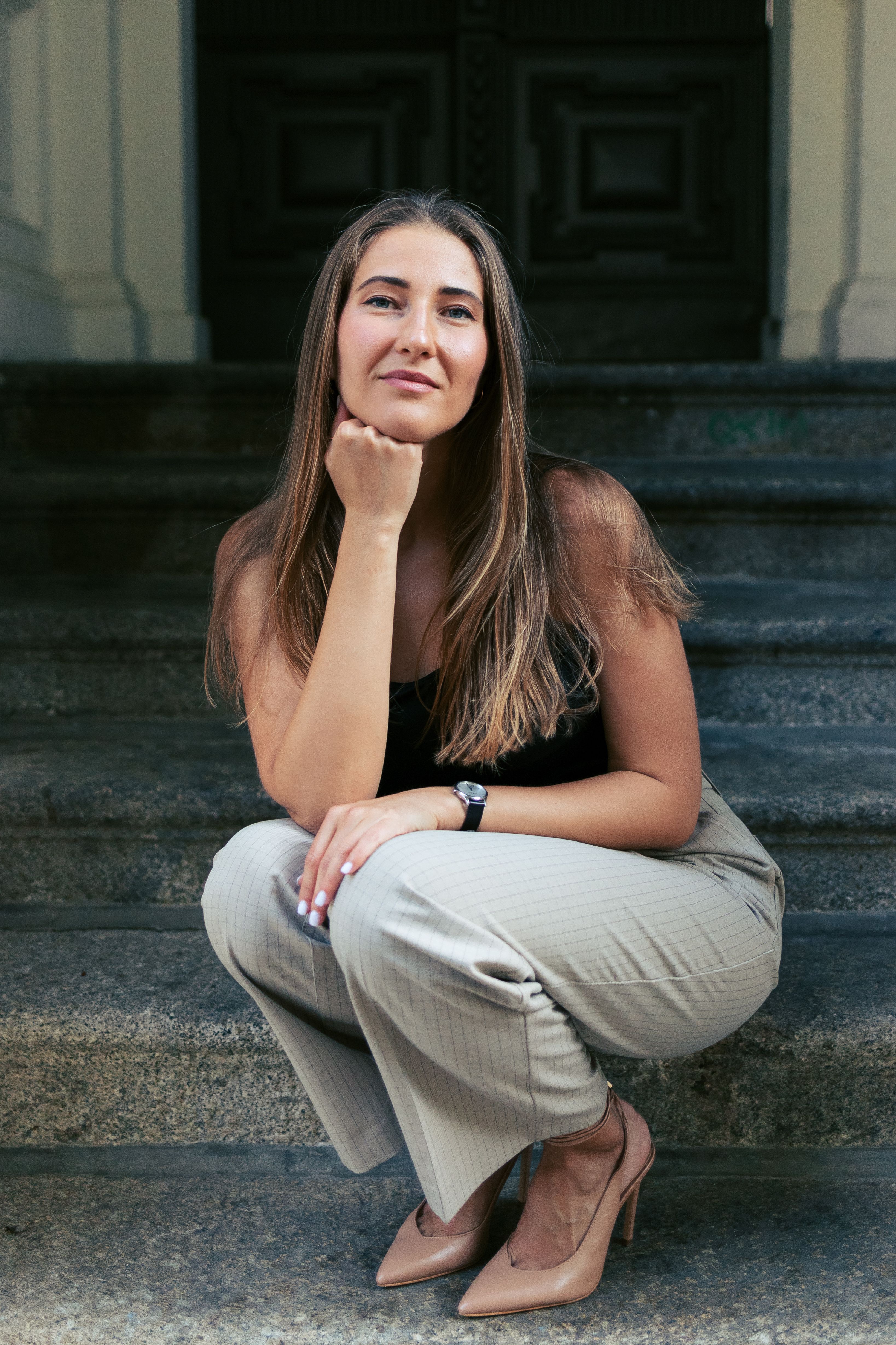 Confident Woman Sitting on Berlin Steps · Free Stock Photo